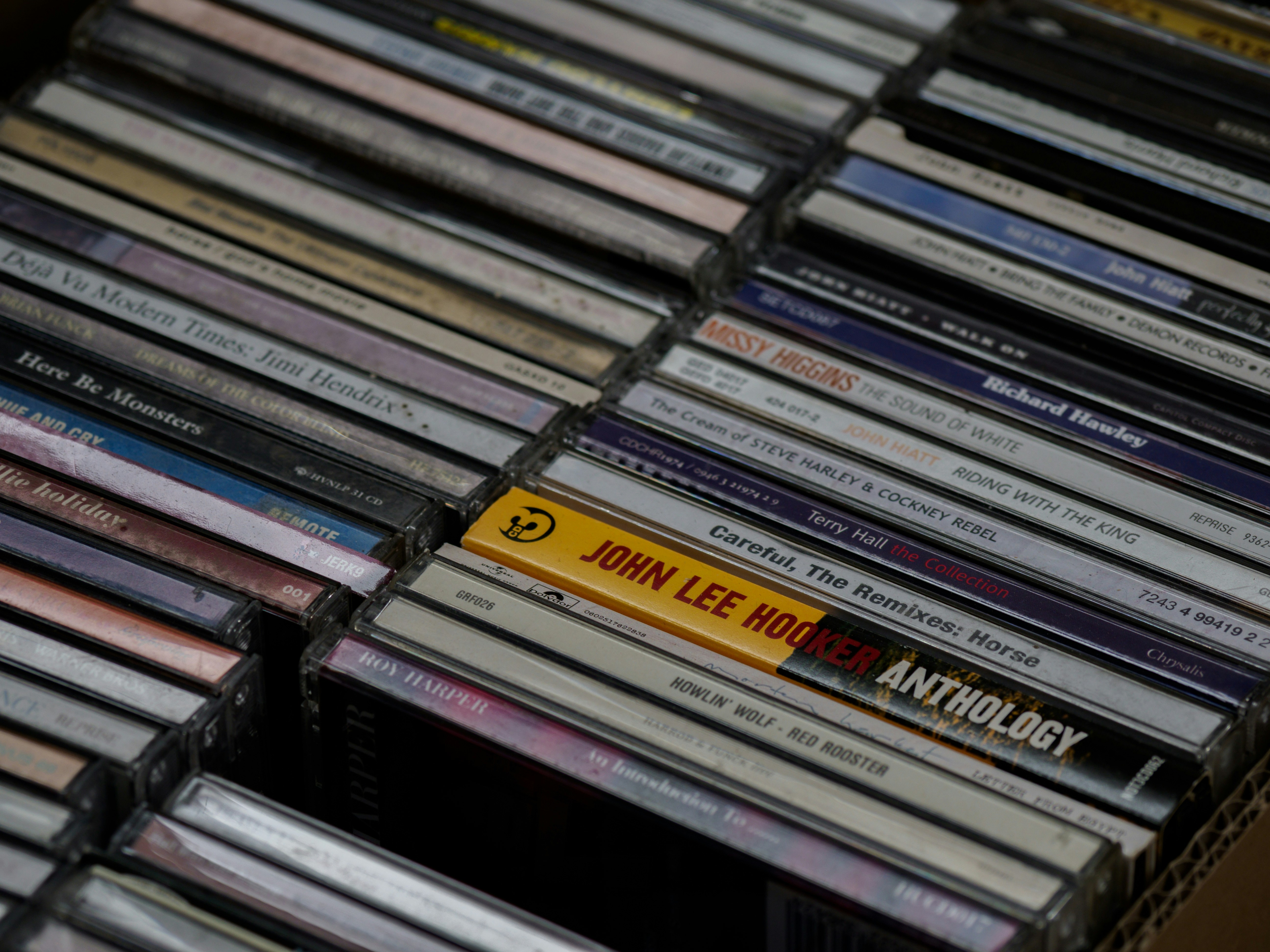 Stack of cd case collection photo – Free Brown Image on Unsplash