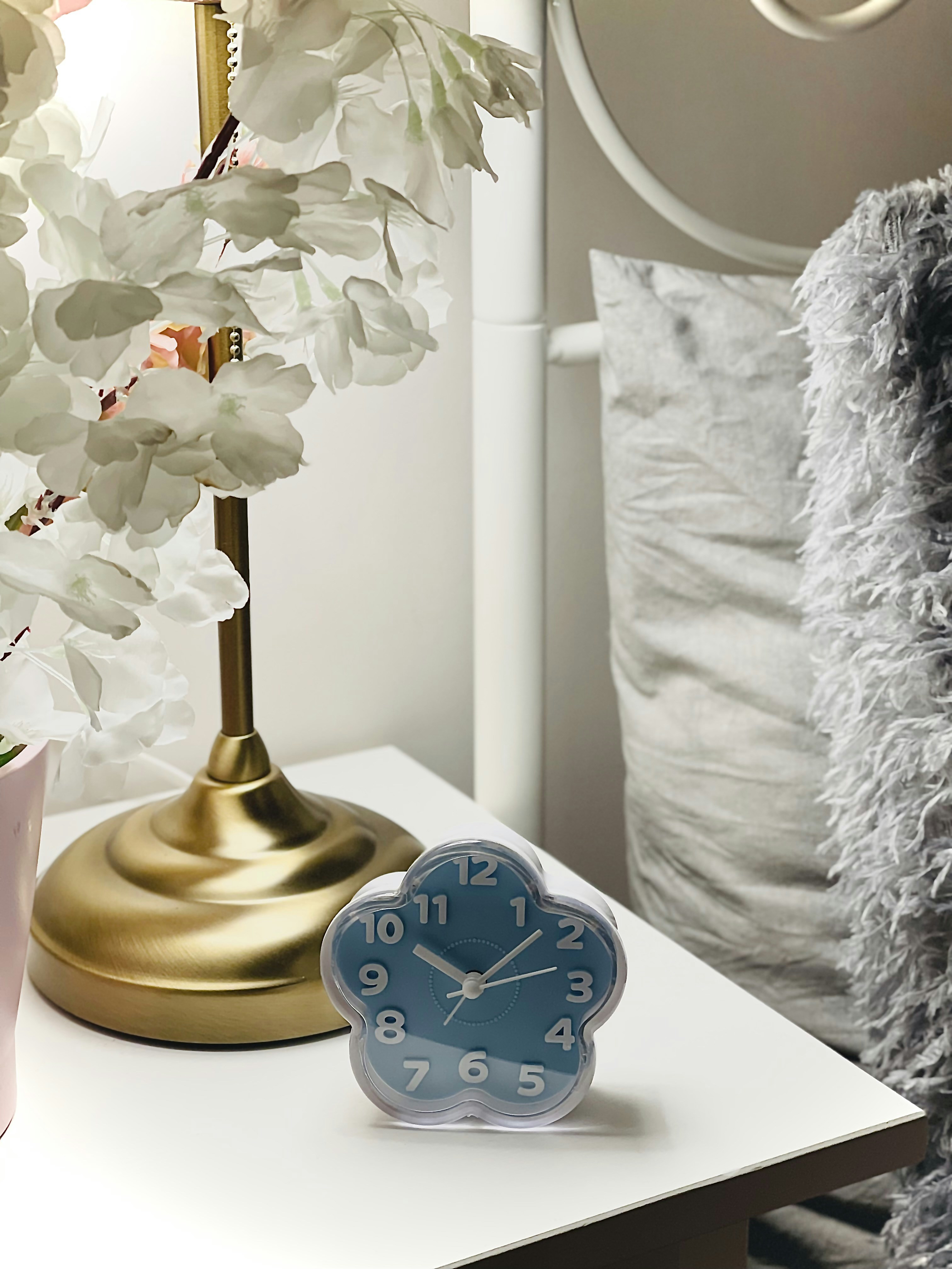 Blue Cloud Clock Anchoring a Minimal Bedside Scene