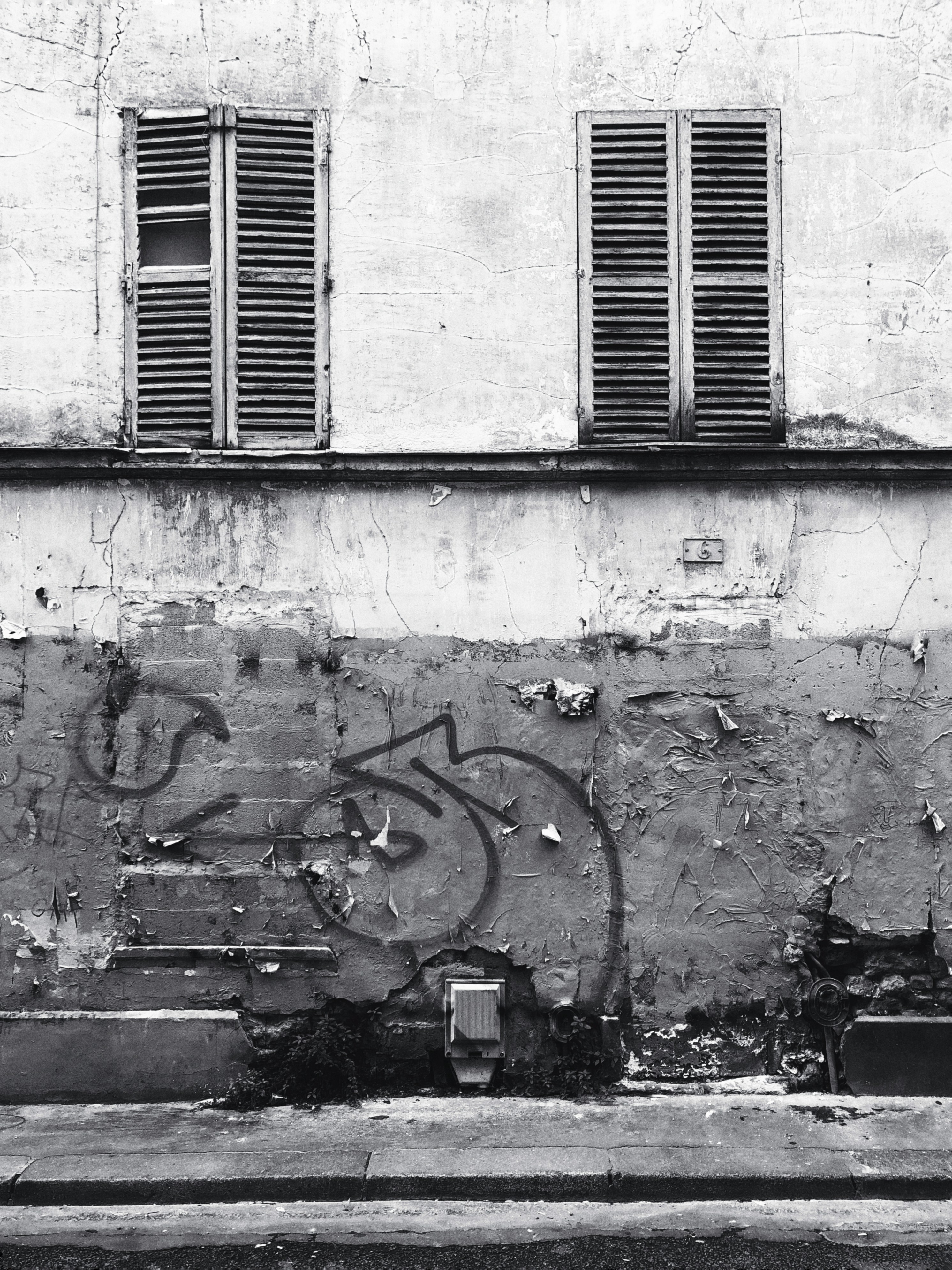 Cracked Facade: A Quiet Tale of Decay and Graffiti
