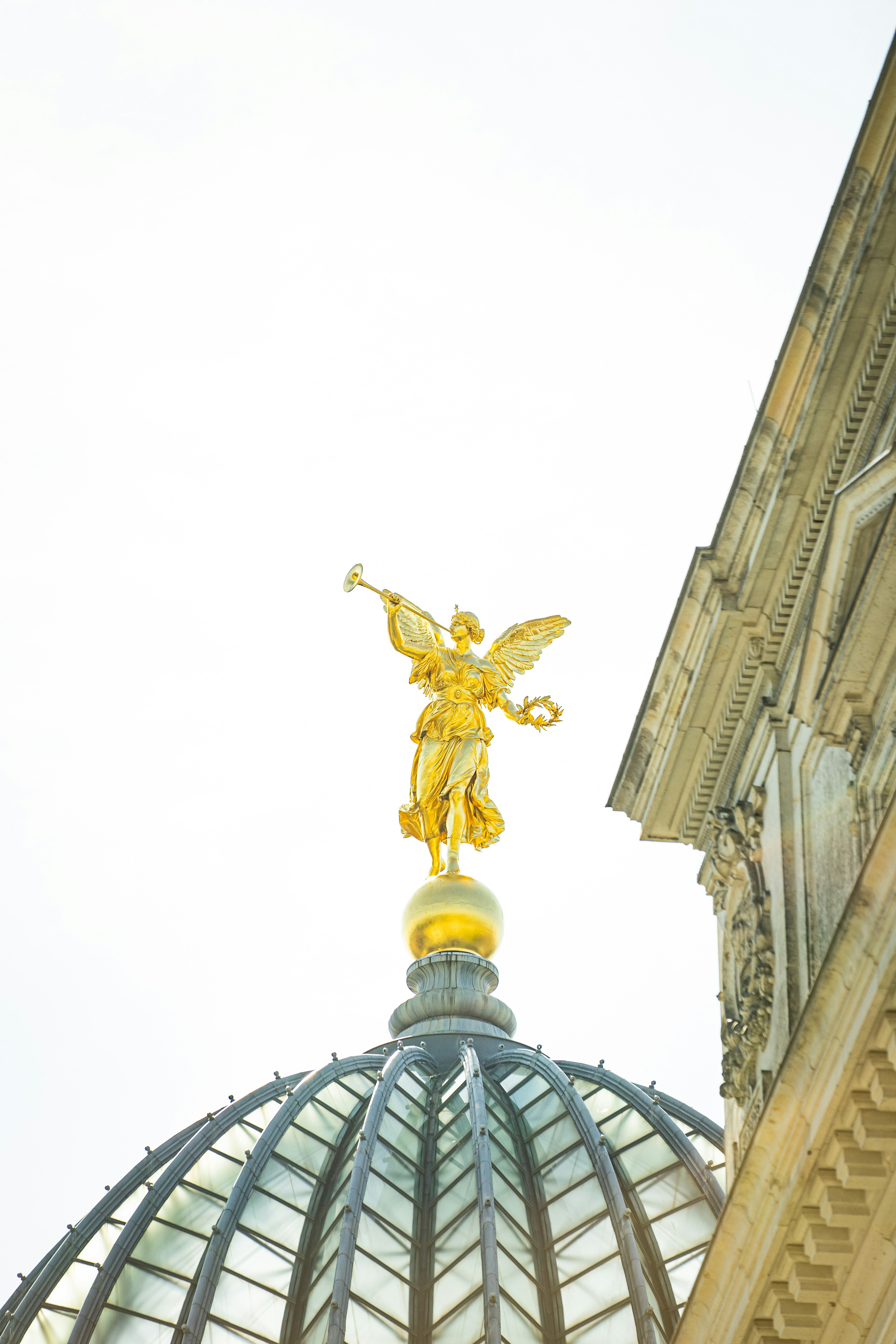 Gilded Winged Victory Above a Glass Dome