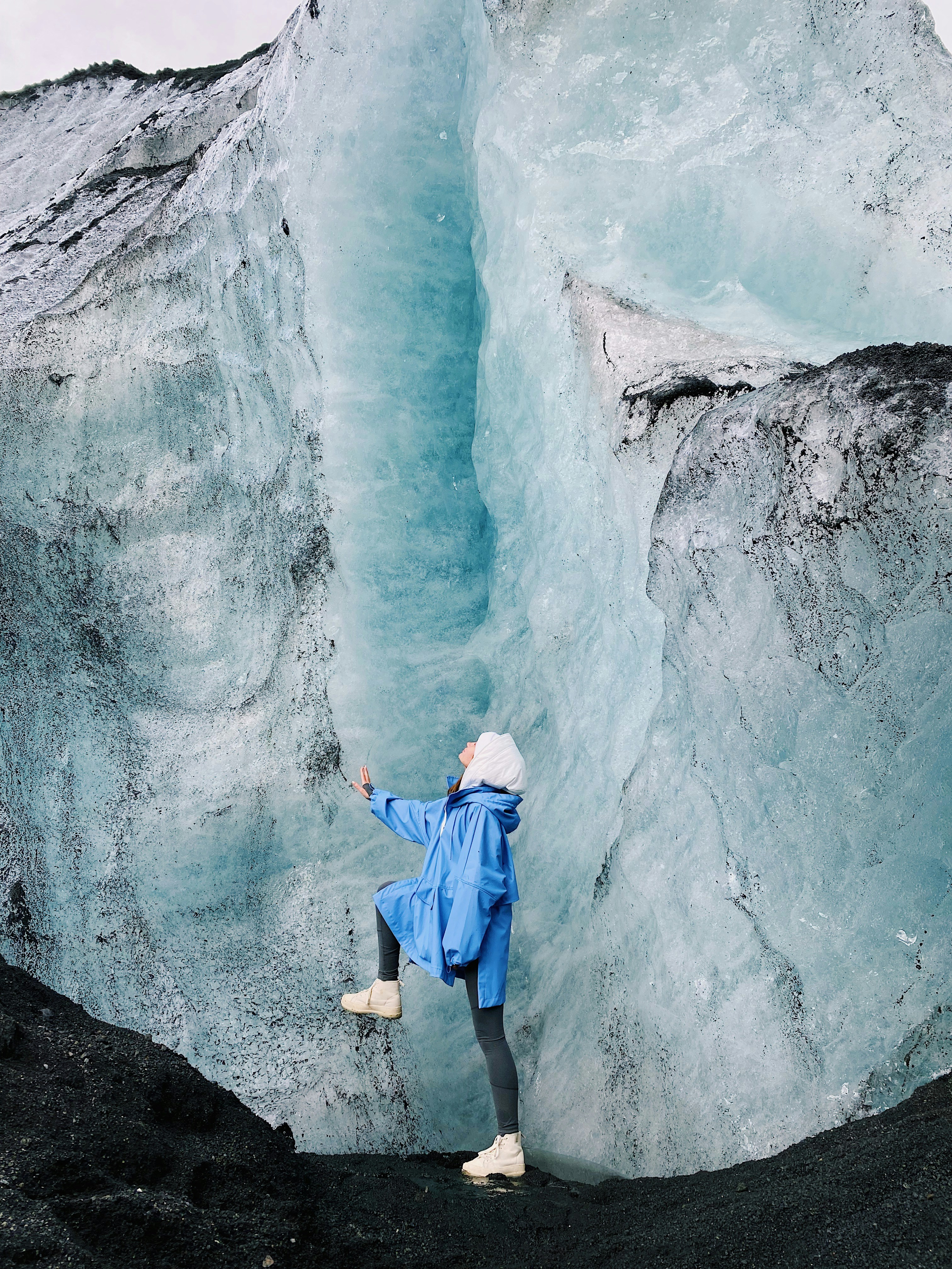 Climber in a Ice Cathedral: A Blue Coat Against the Glacier’s Veins