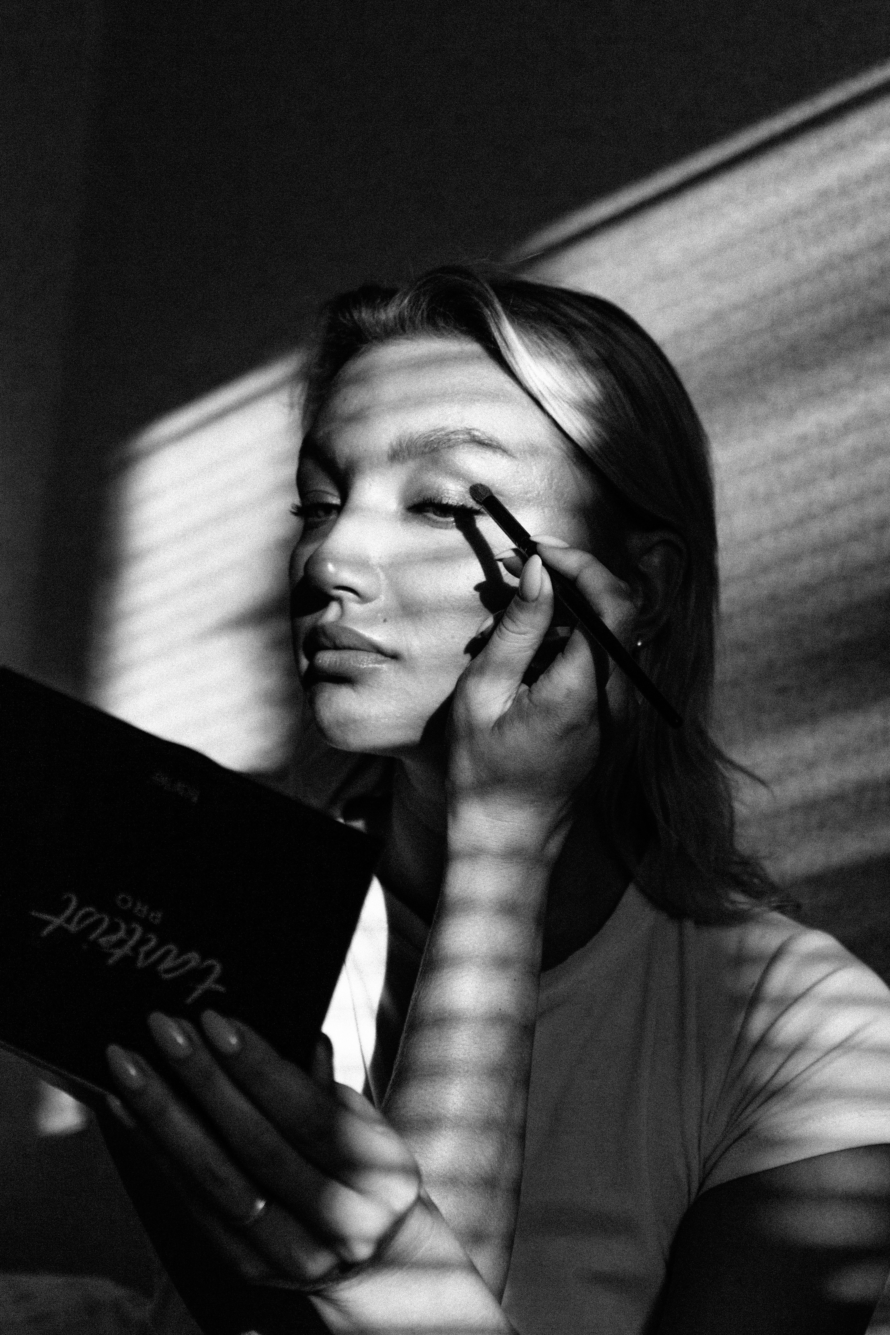 Woman in white crew neck t-shirt holding black smartphone photo – Free ...