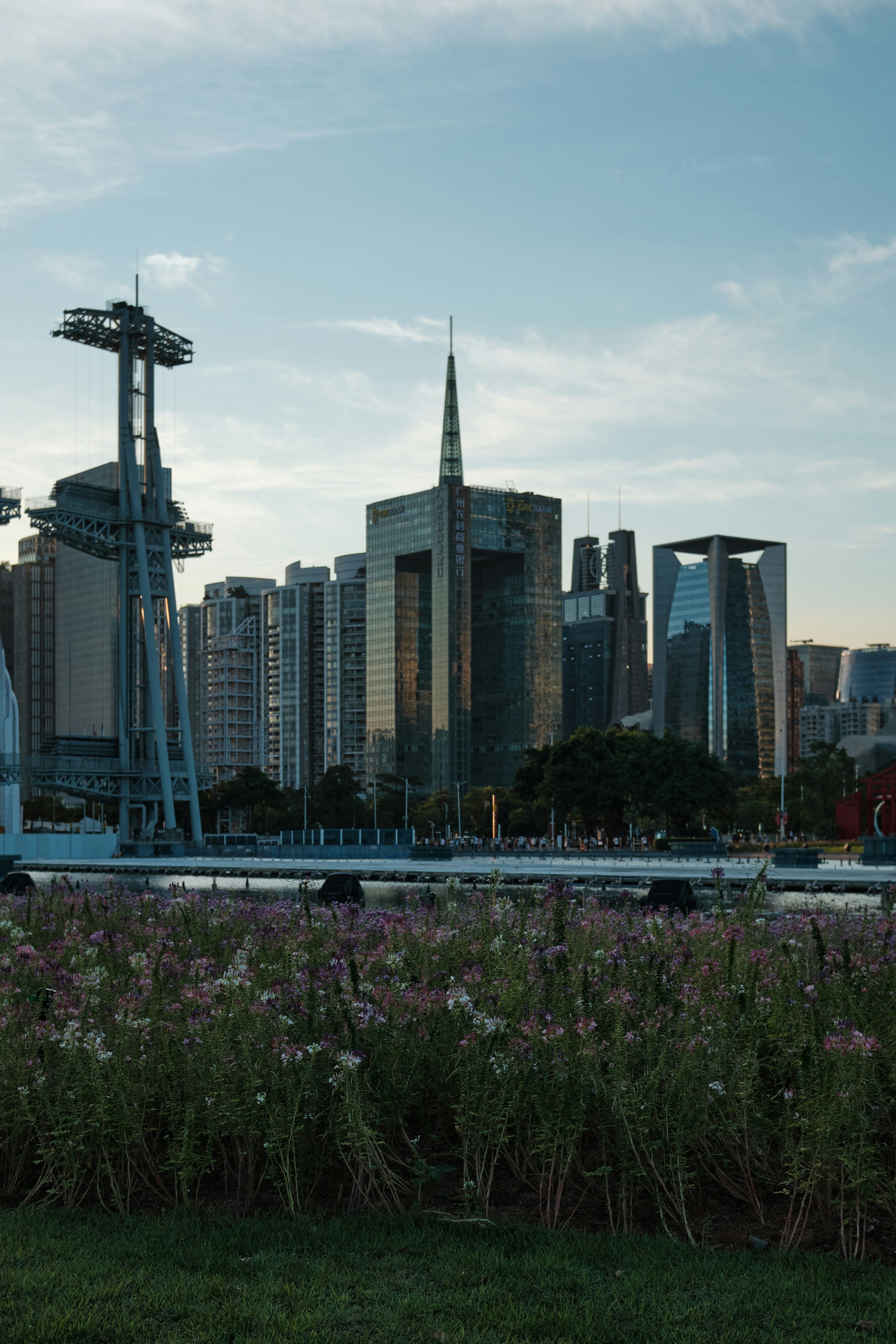 Black and white windmill near high rise buildings during daytime photo ...