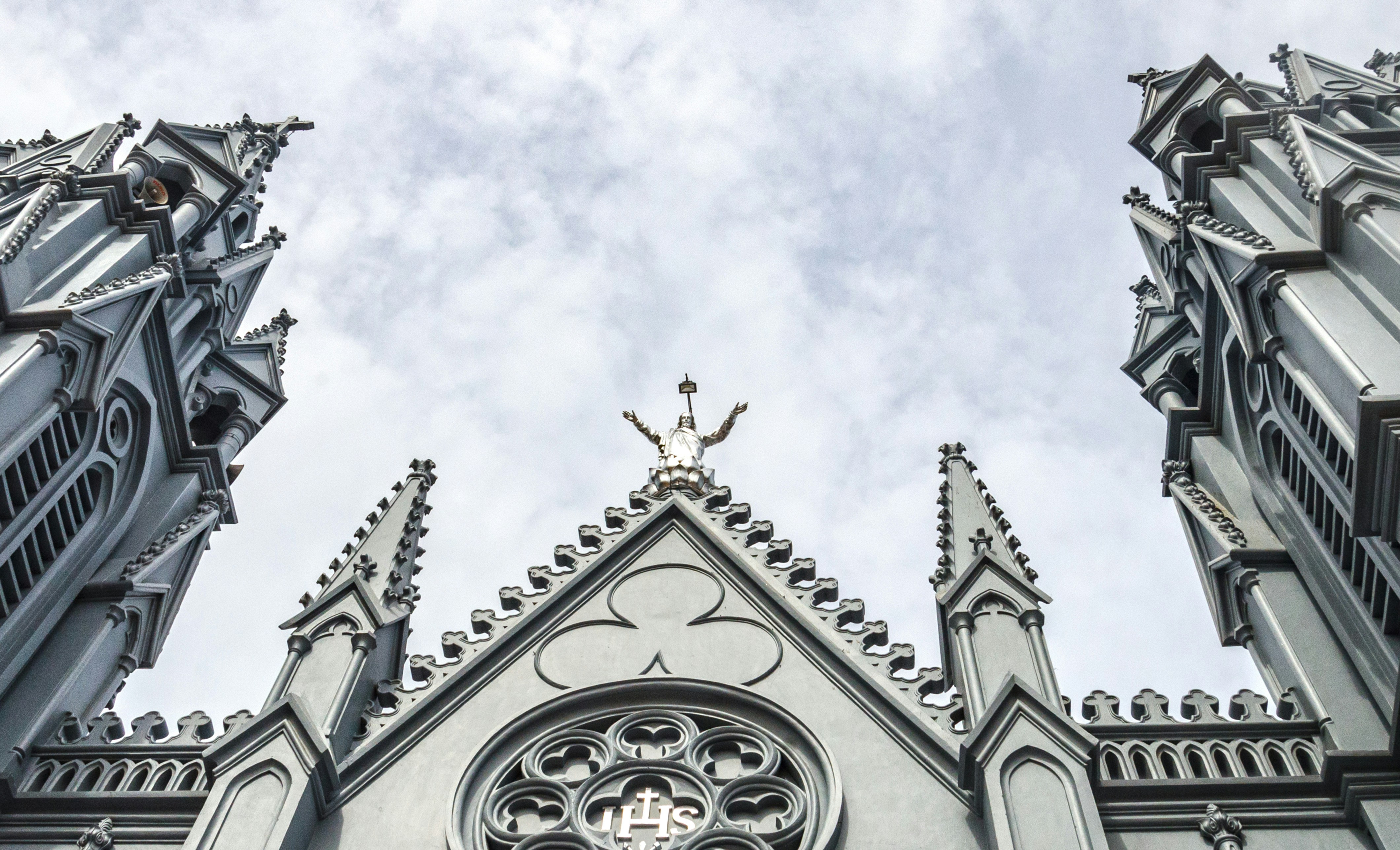 White and gray concrete church under white clouds during daytime photo ...