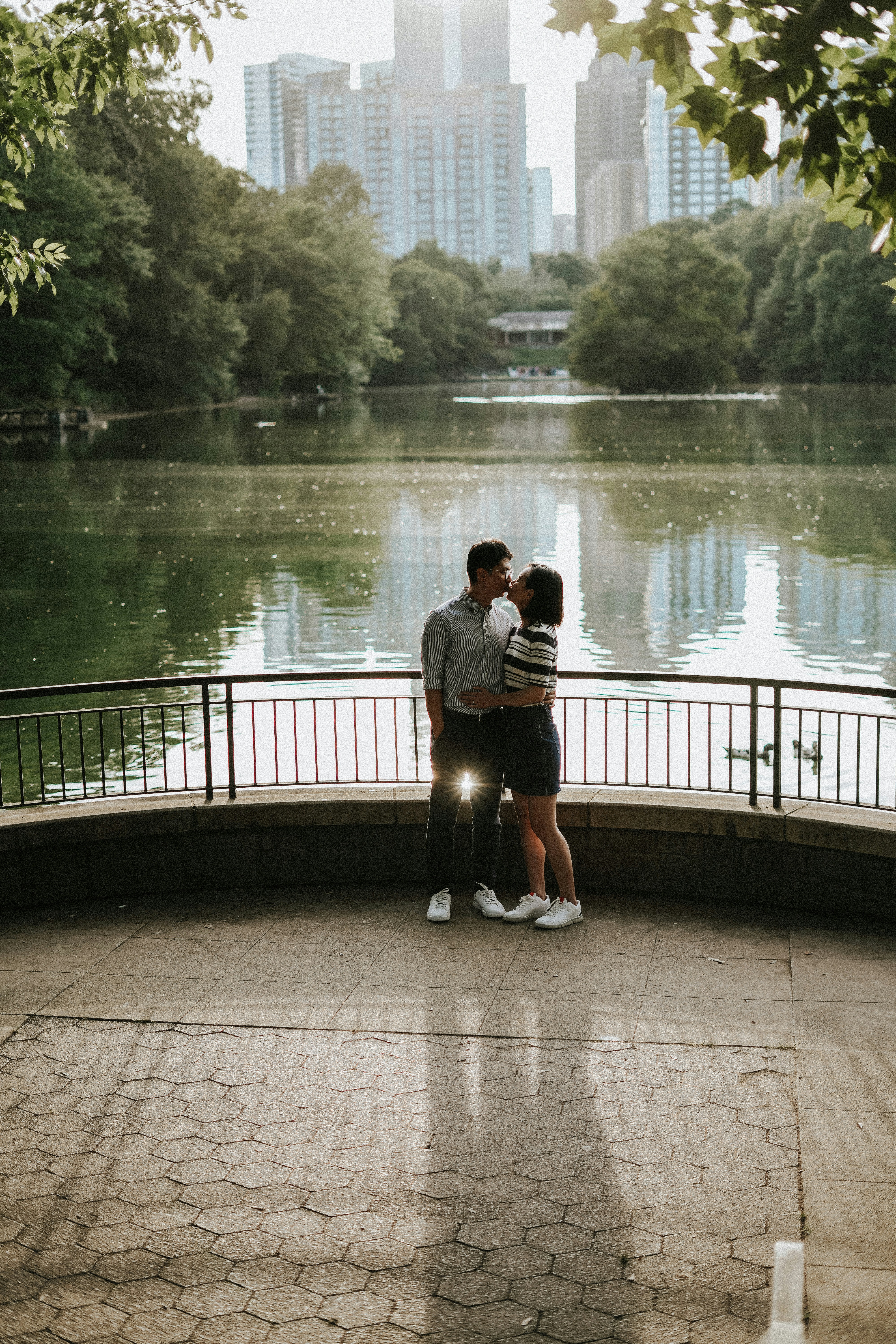 Riverside Embrace beneath a Cityscape’s Quiet Glimmer