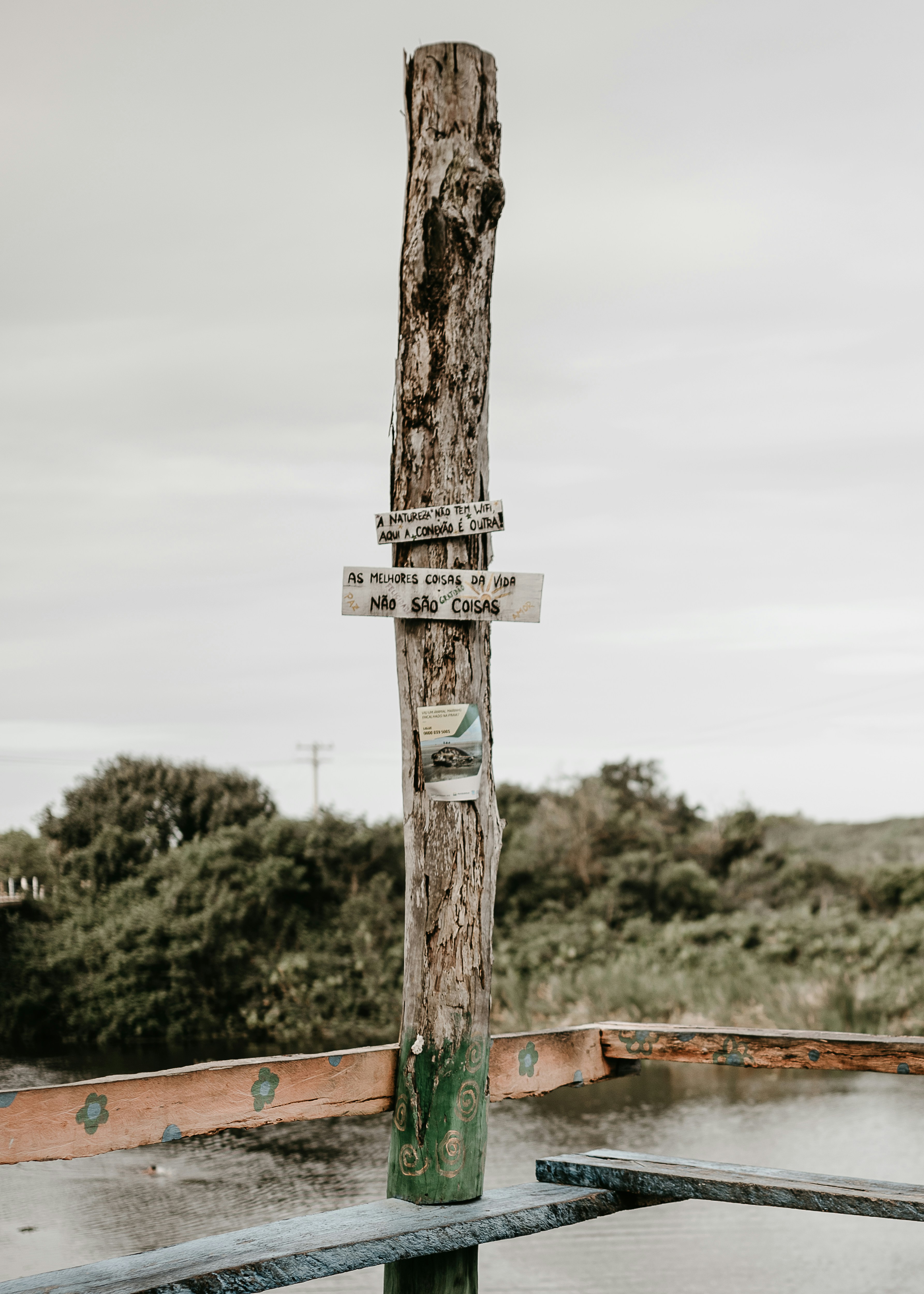 Weathered Signpost on a Quiet Waterway Pier