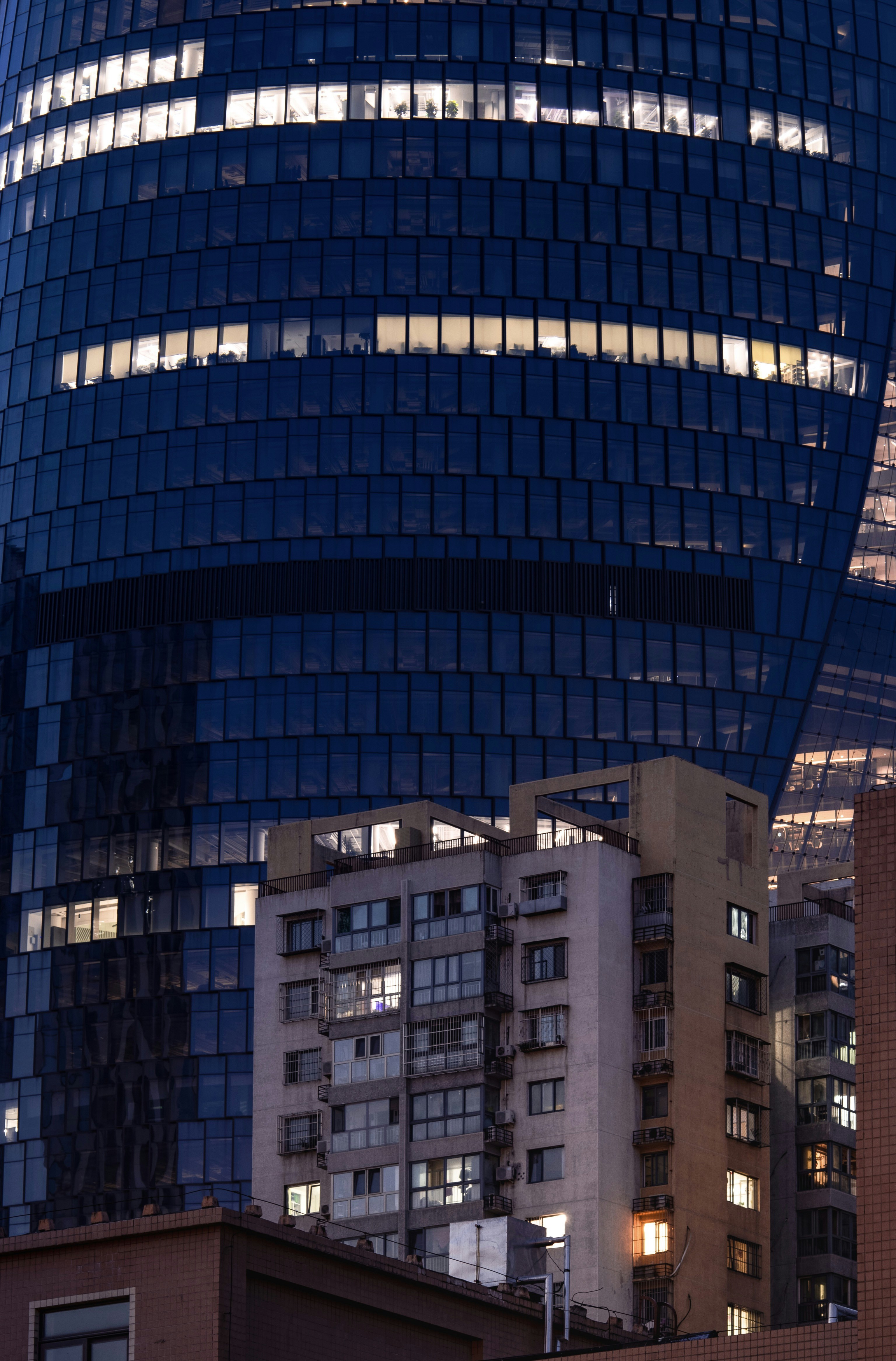 Cobalt Crescent: Nighttime Ballet of Glass and Steel