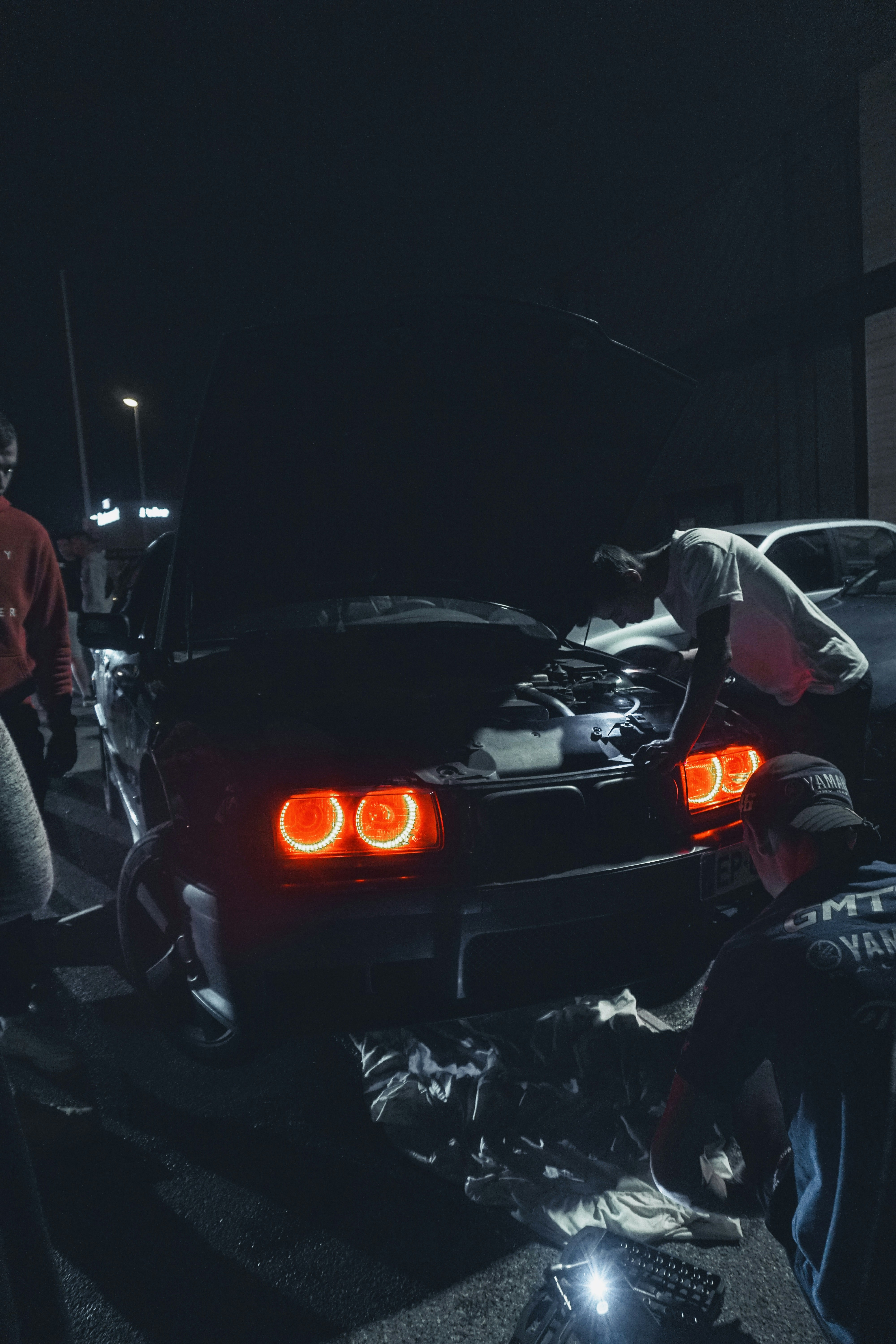 Midnight Tune-Up: Red Taillights and a Car in Need of Care