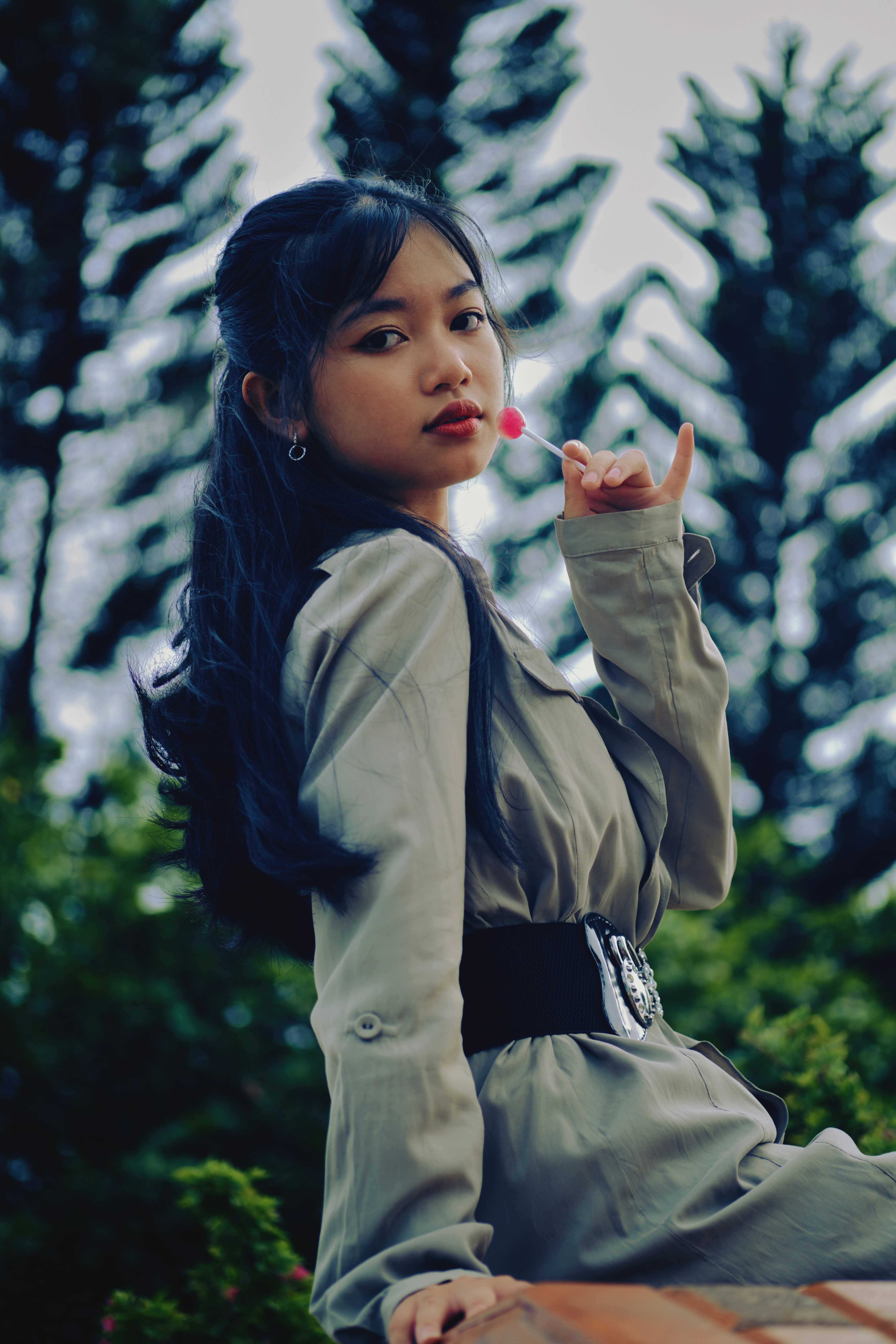Forest Gaze: A Portrait with a Candy-Pink Lollipop in Soft Evening Light