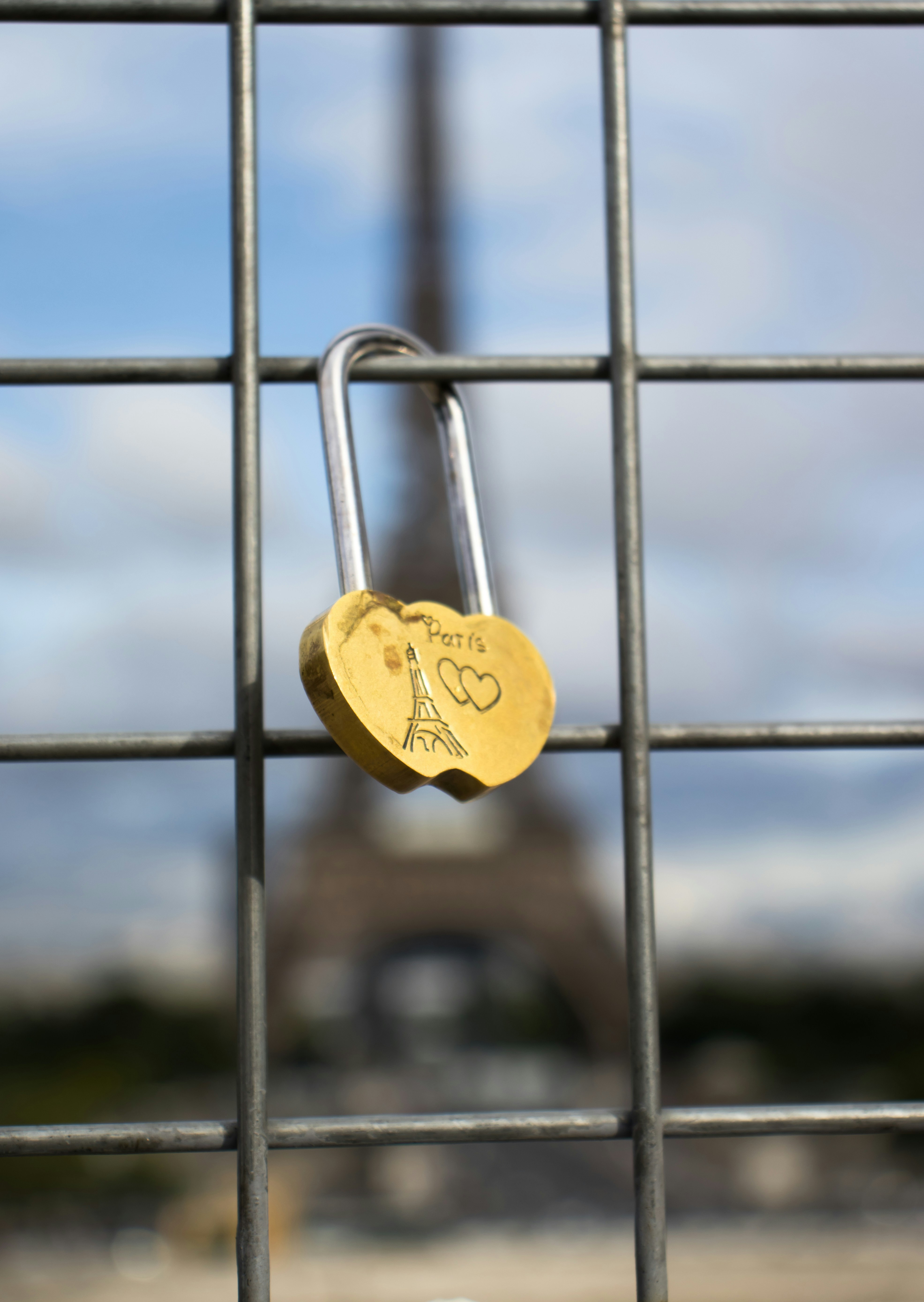 Gold padlock on black metal fence photo – Free Eiffel tower Image on ...