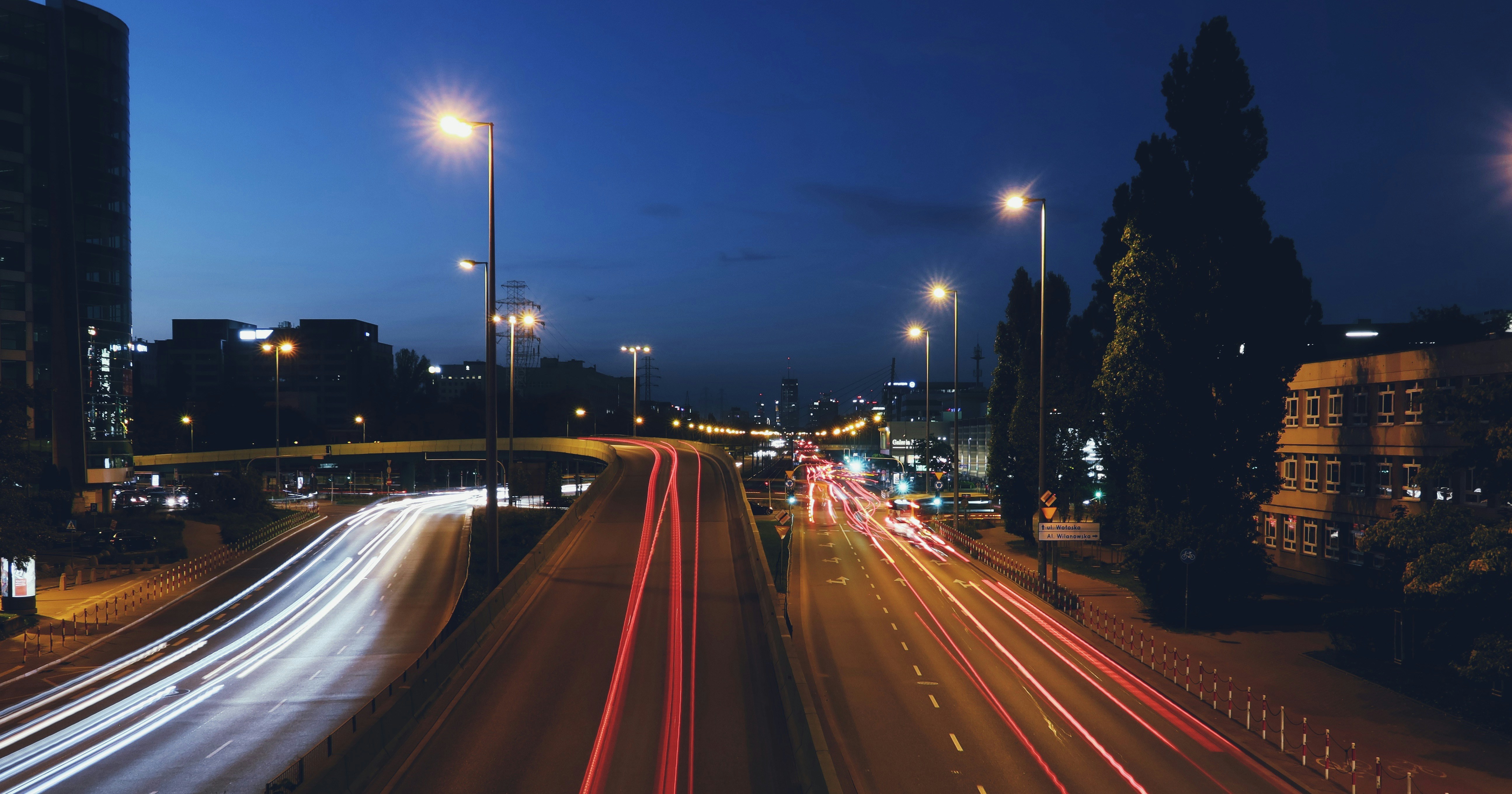 time lapse photography of cars on road during night time