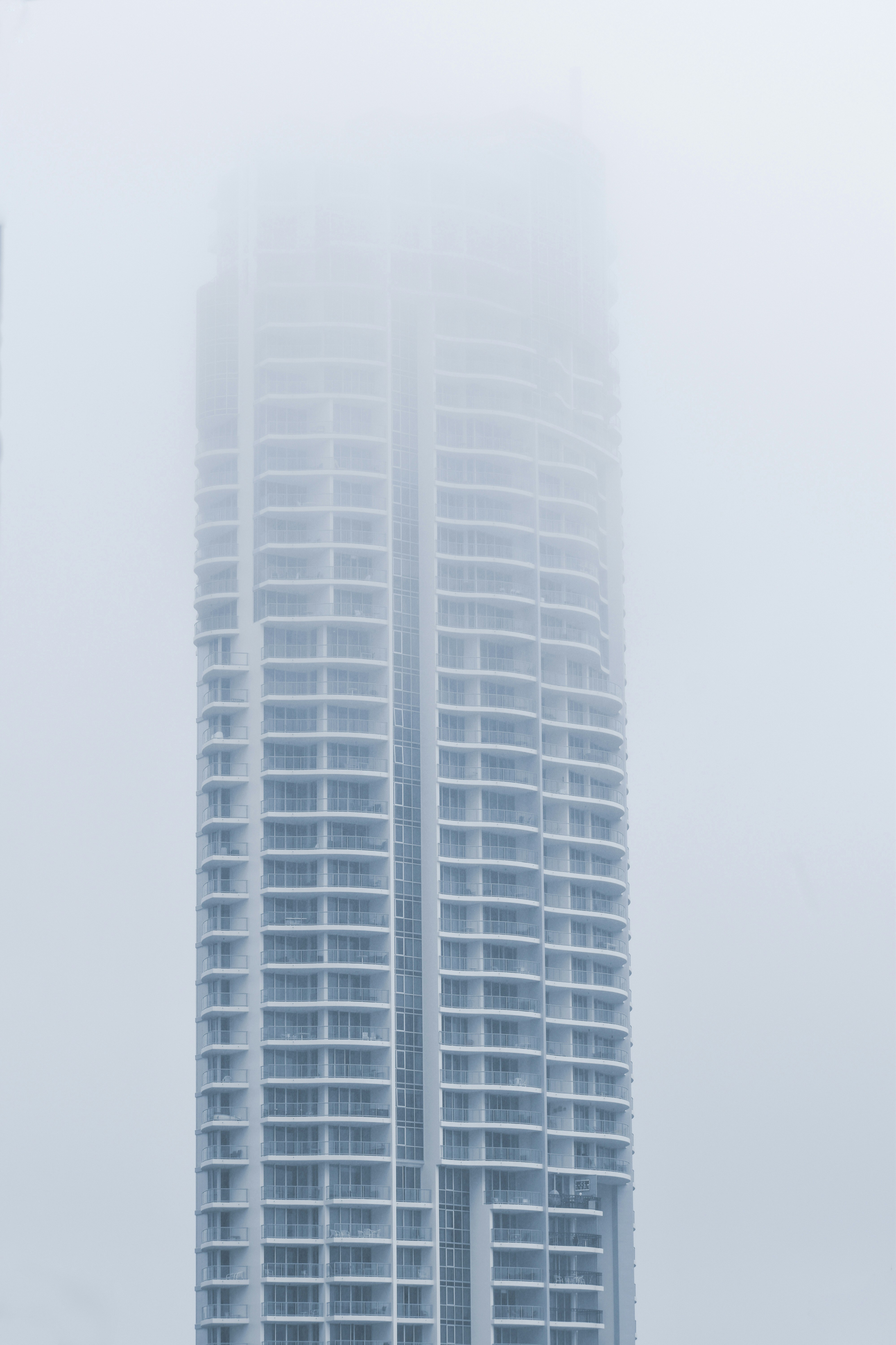 Hazebound Monolith: A Fog-Wrapped Tower Vanishing into the Sky