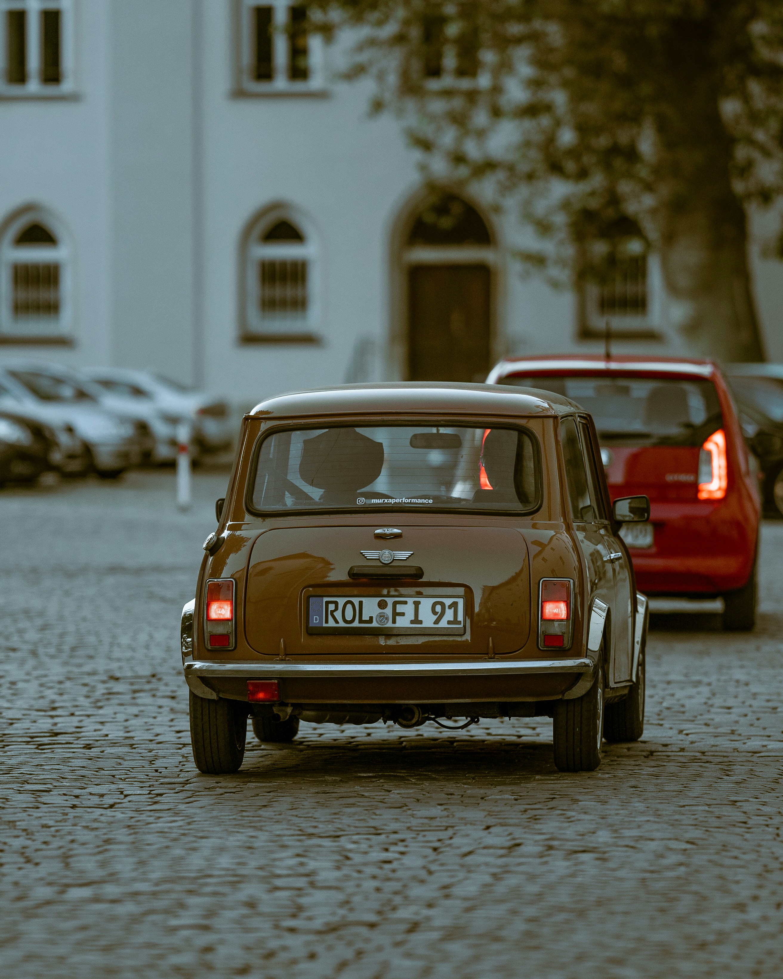 Rear-View Reverie on a Cobblestone Boulevard