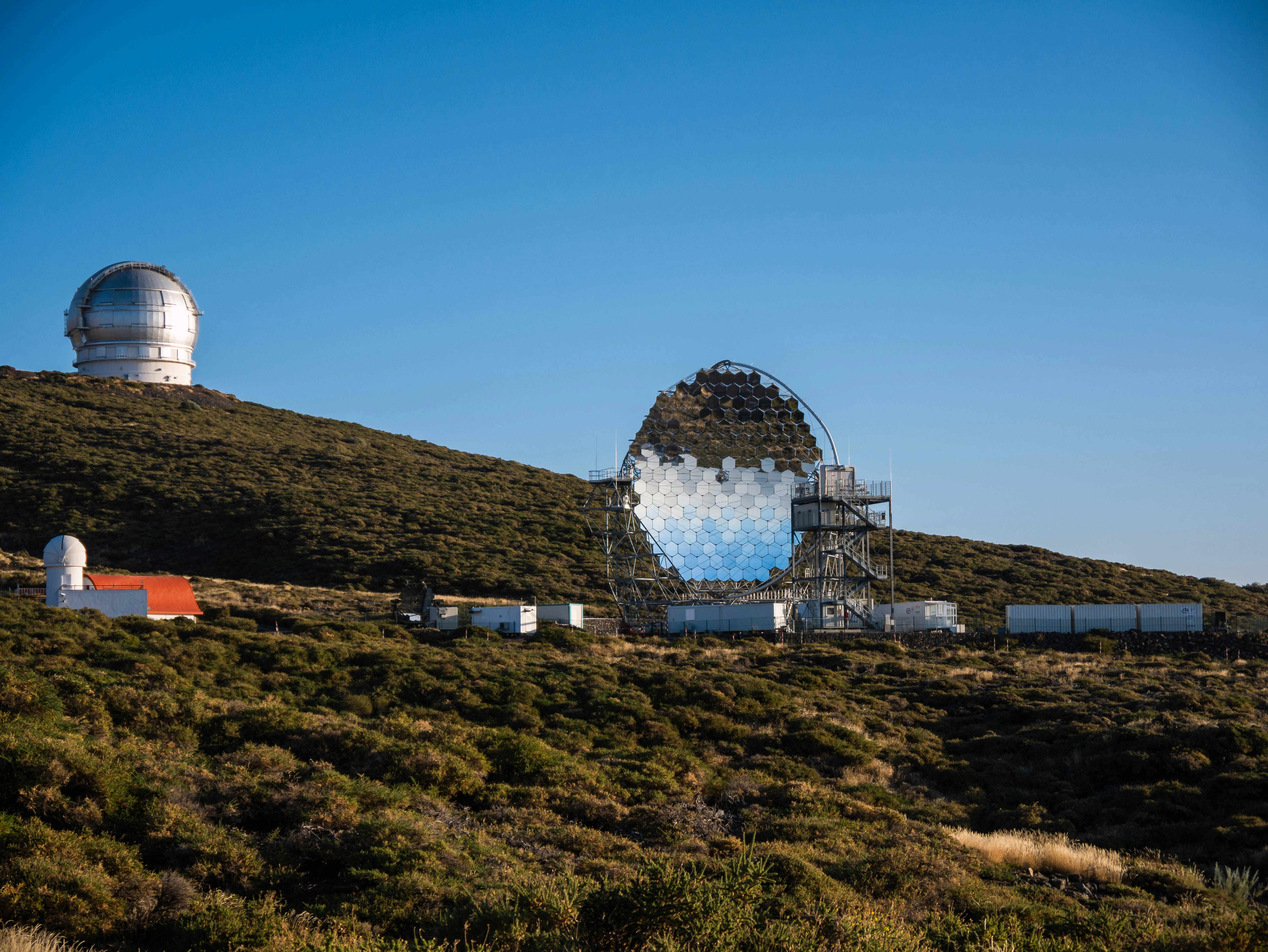 white and black building under blue sky during daytime
