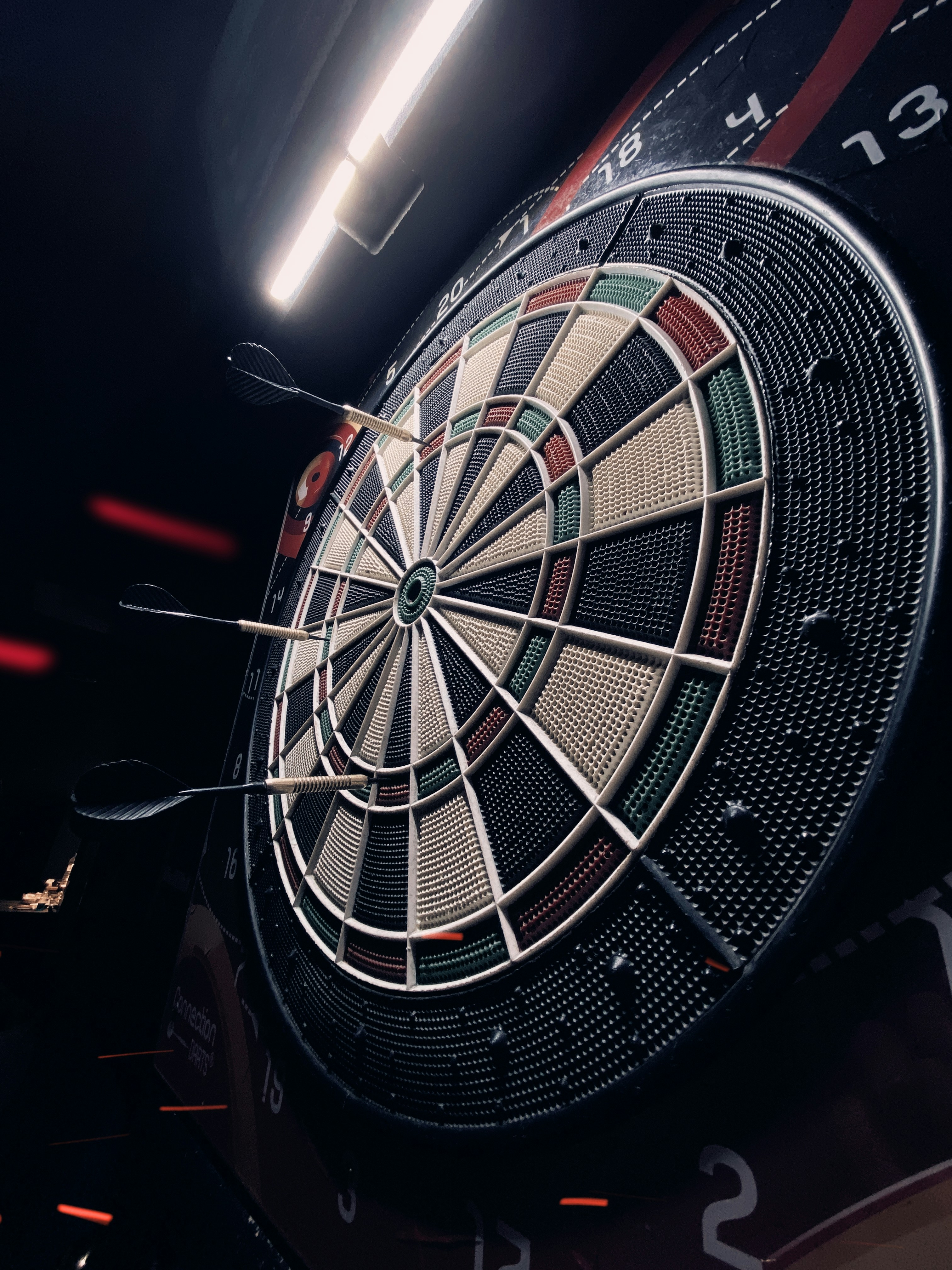 A close up of a dart board in a room photo – Free Agadir Image on Unsplash
