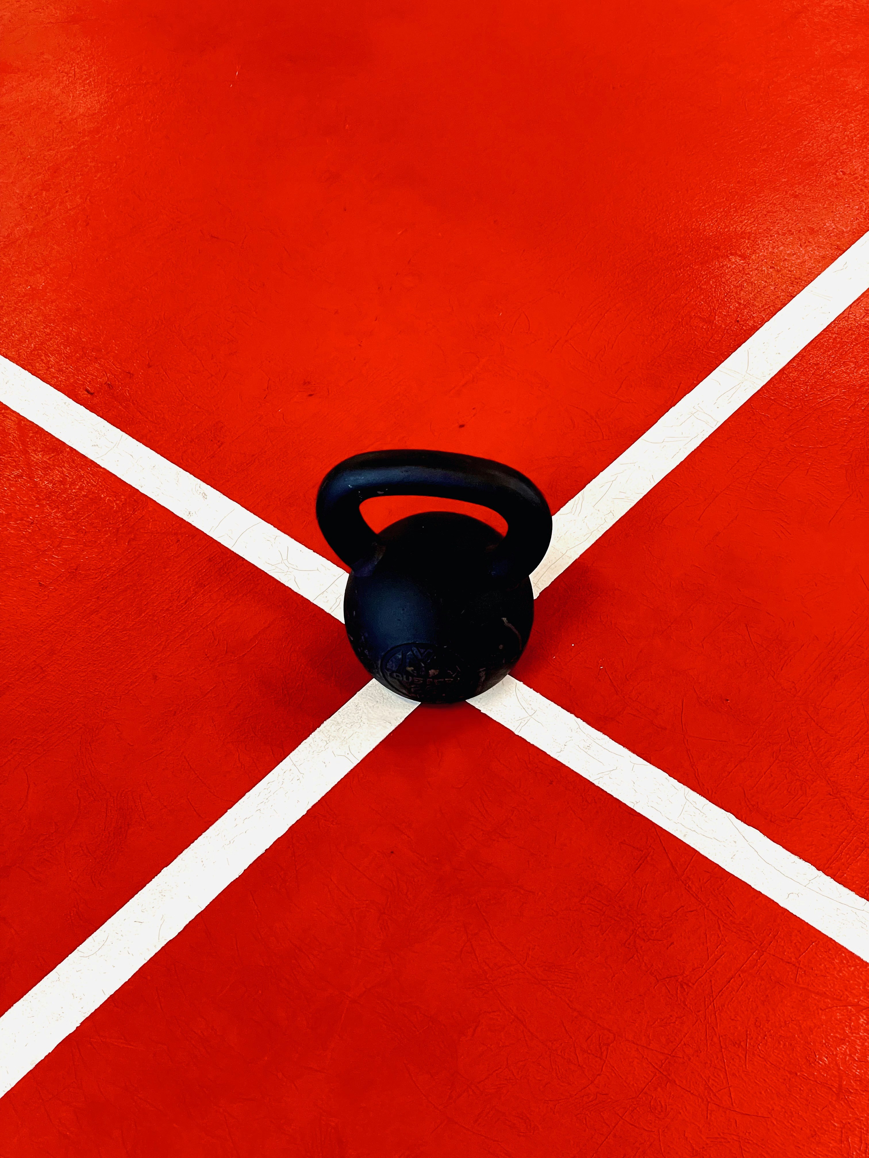 Kettlebell at the Crossing: Bold Red Lines and a Black Weight