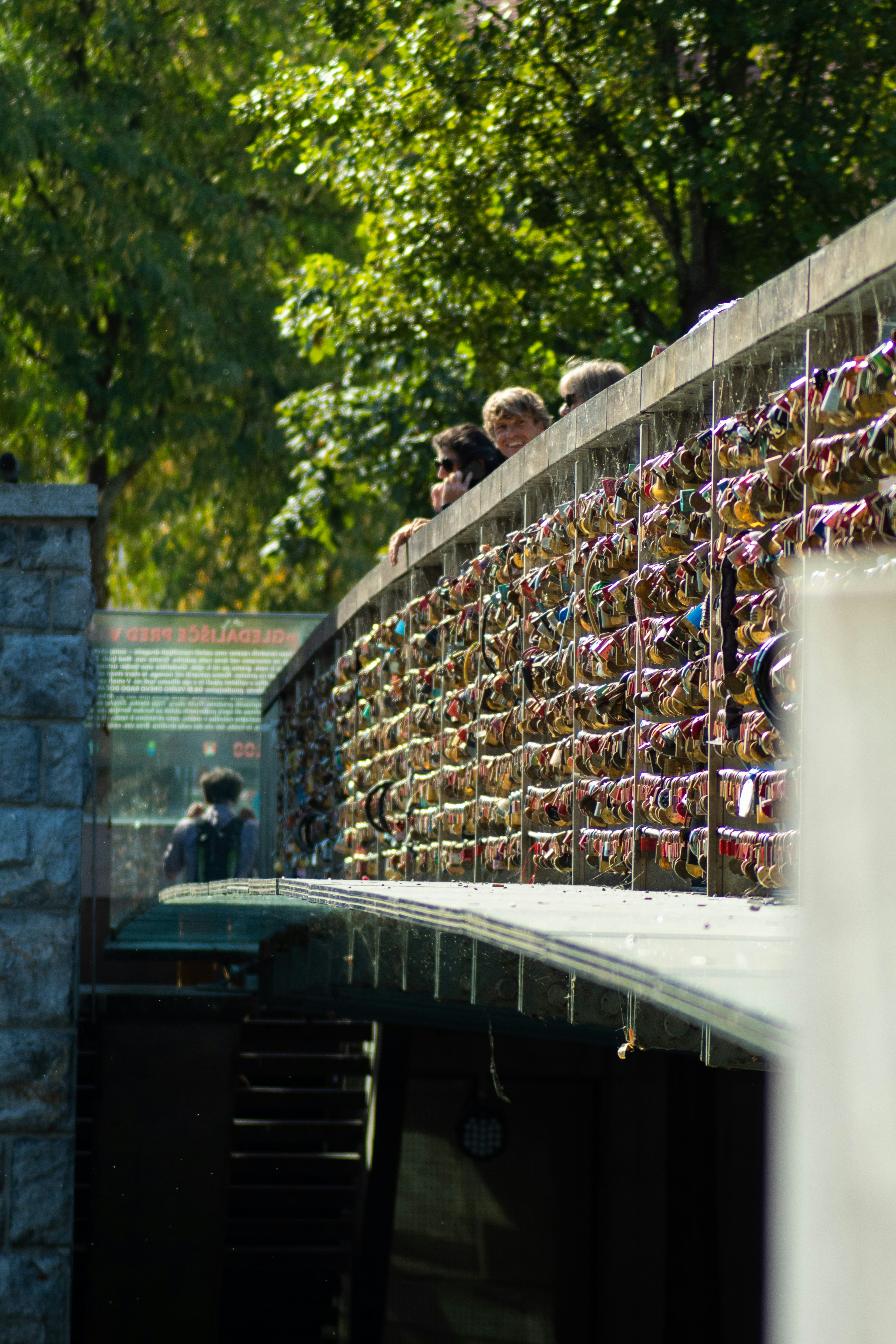 A group of people standing on top of a bridge photo – Free Love Image ...