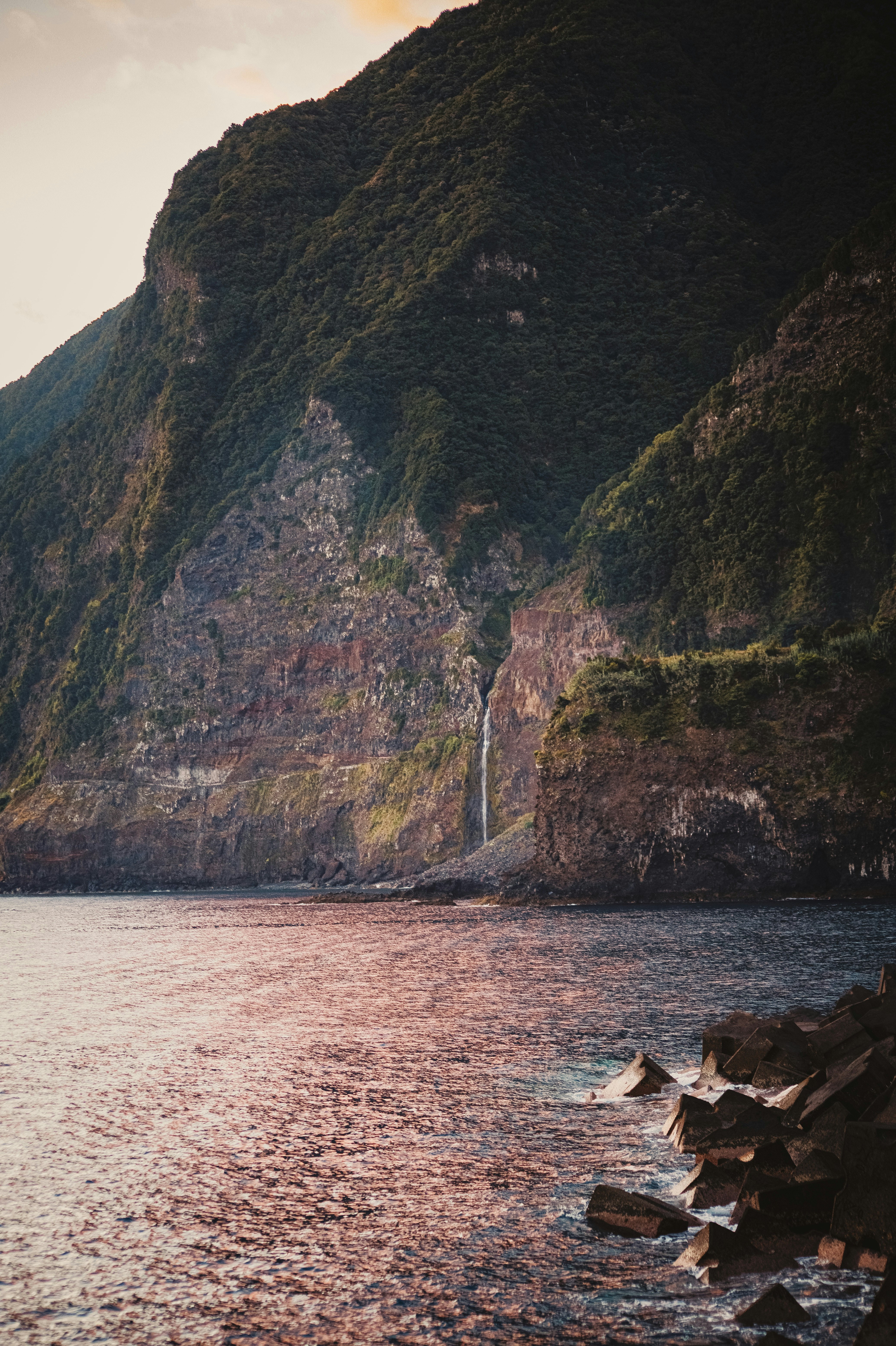 Sea Cliff Cascade at Dusk: A Quiet Waterfall Carving the Rockface