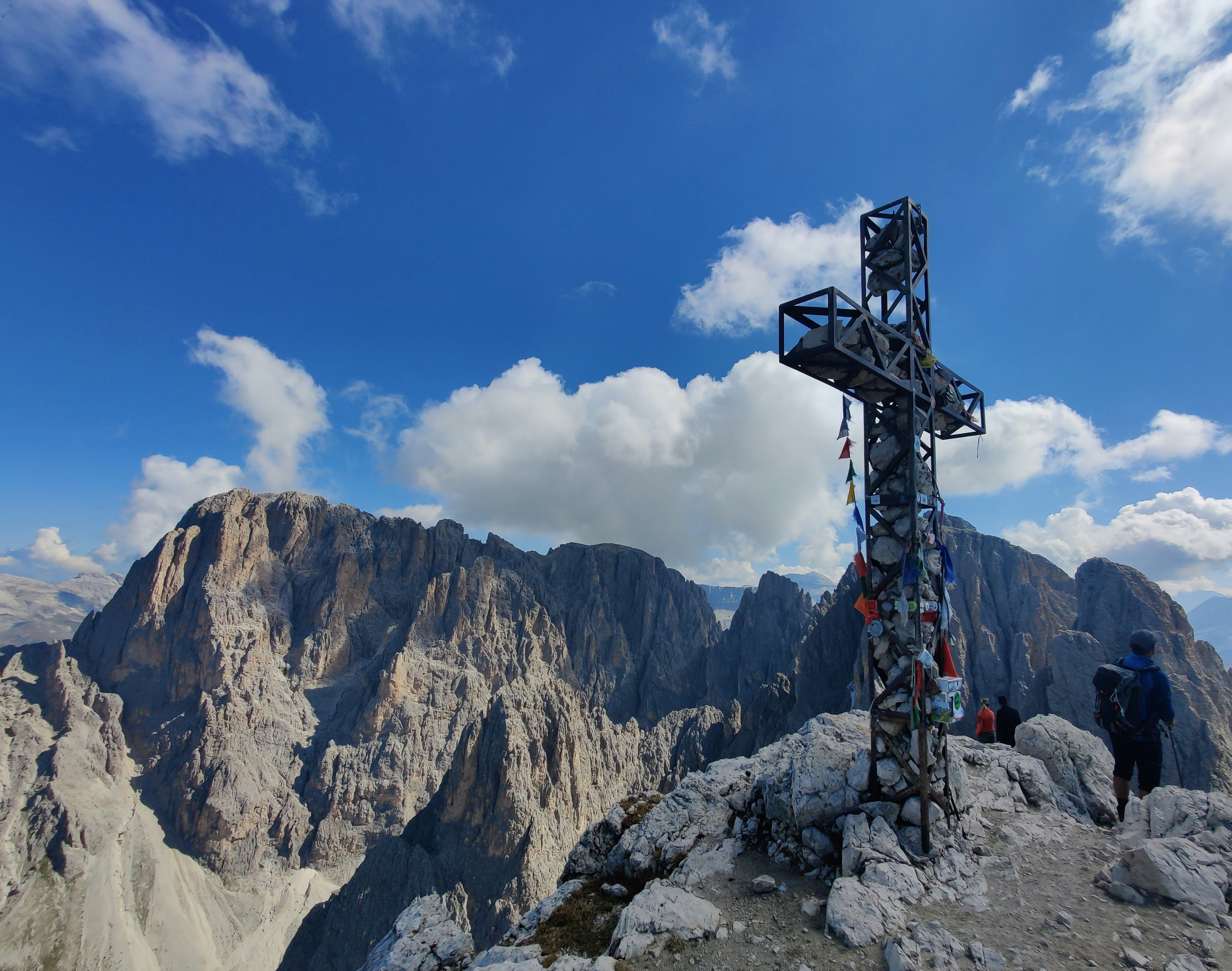 Cross at the Crest: Granite Spires Beneath a Cerulean Sky