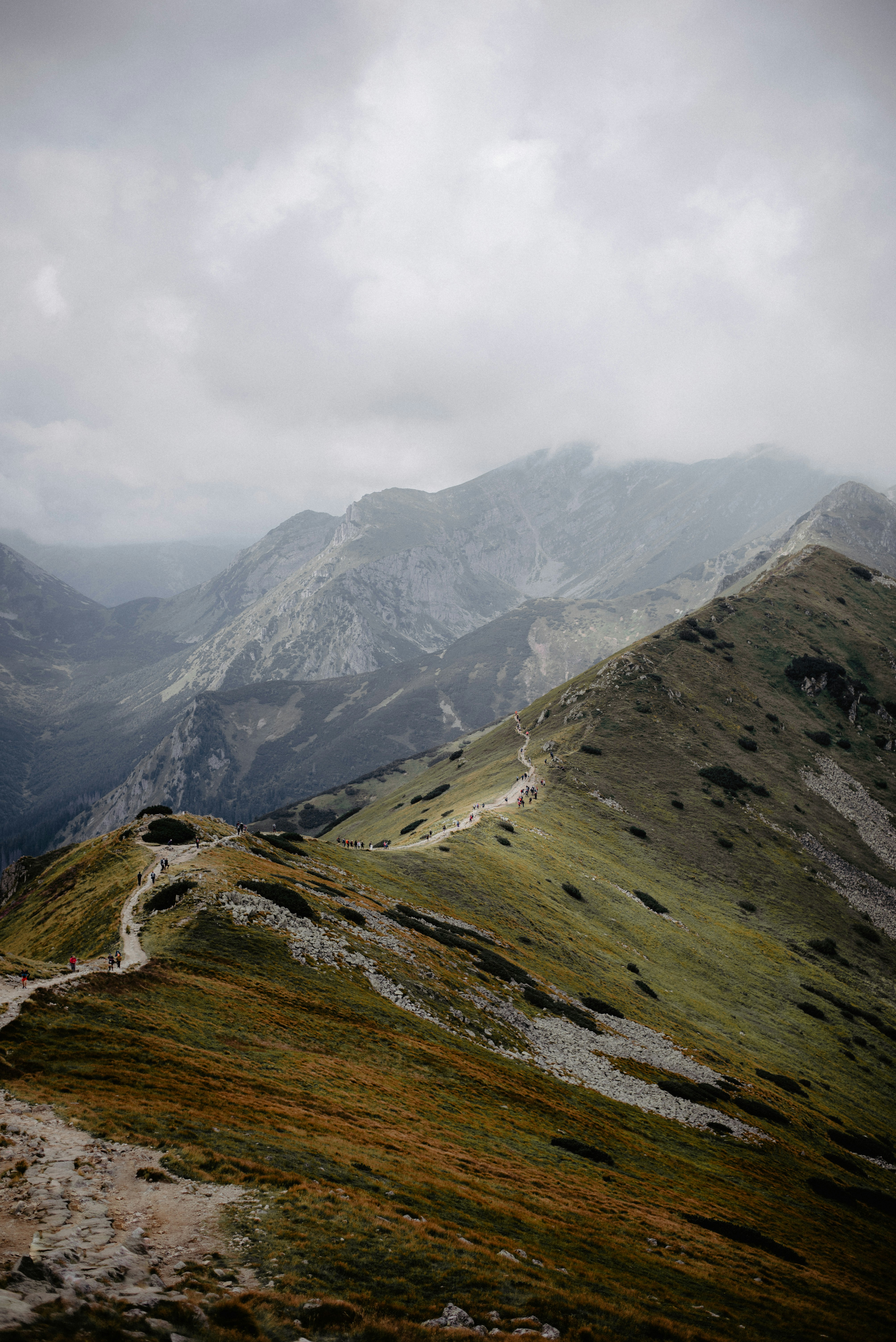A view of a mountain with a path going up the side of it photo – Free ...