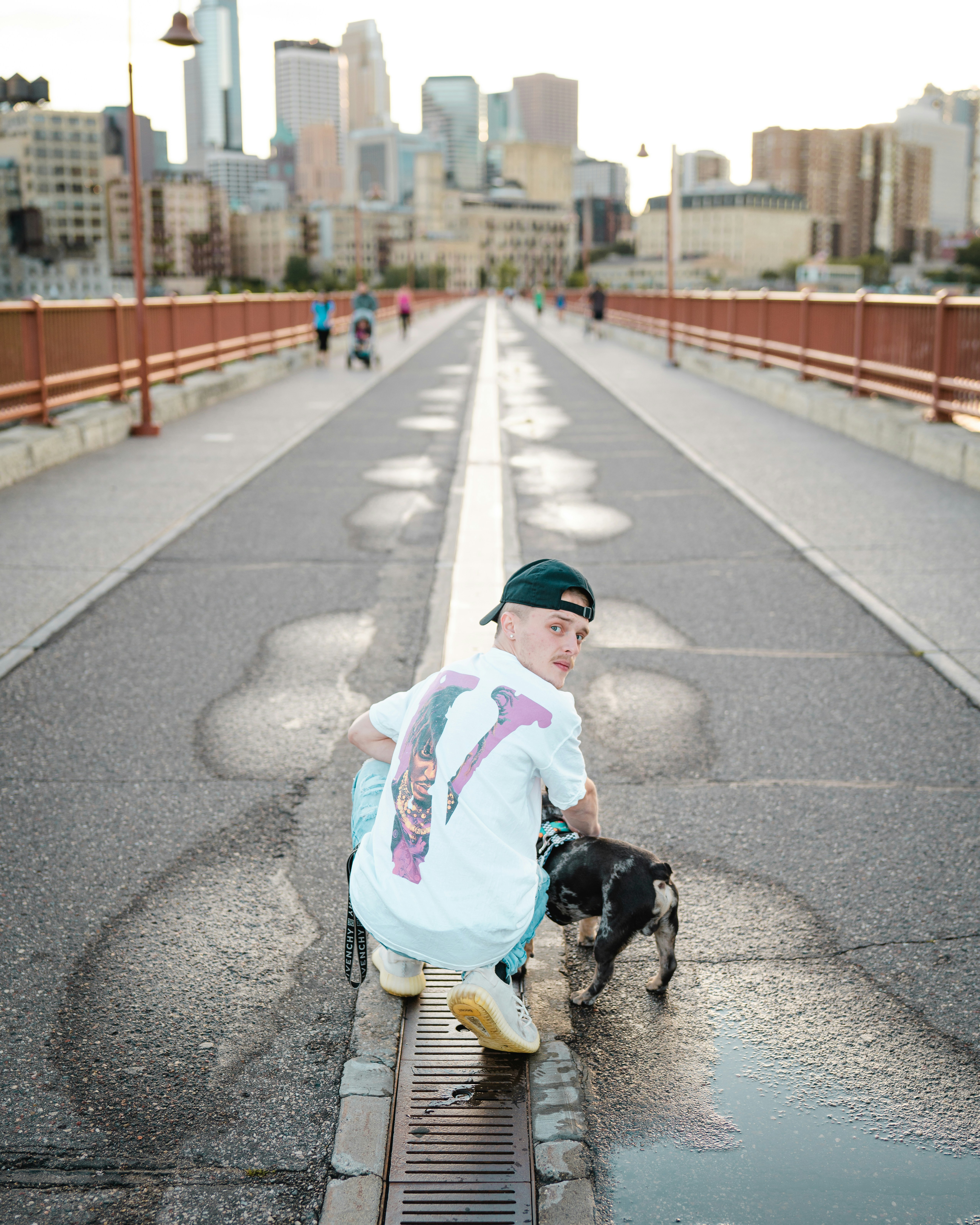 On the Aqualine Bridge: A Man, A Dog, and the City in Perspective