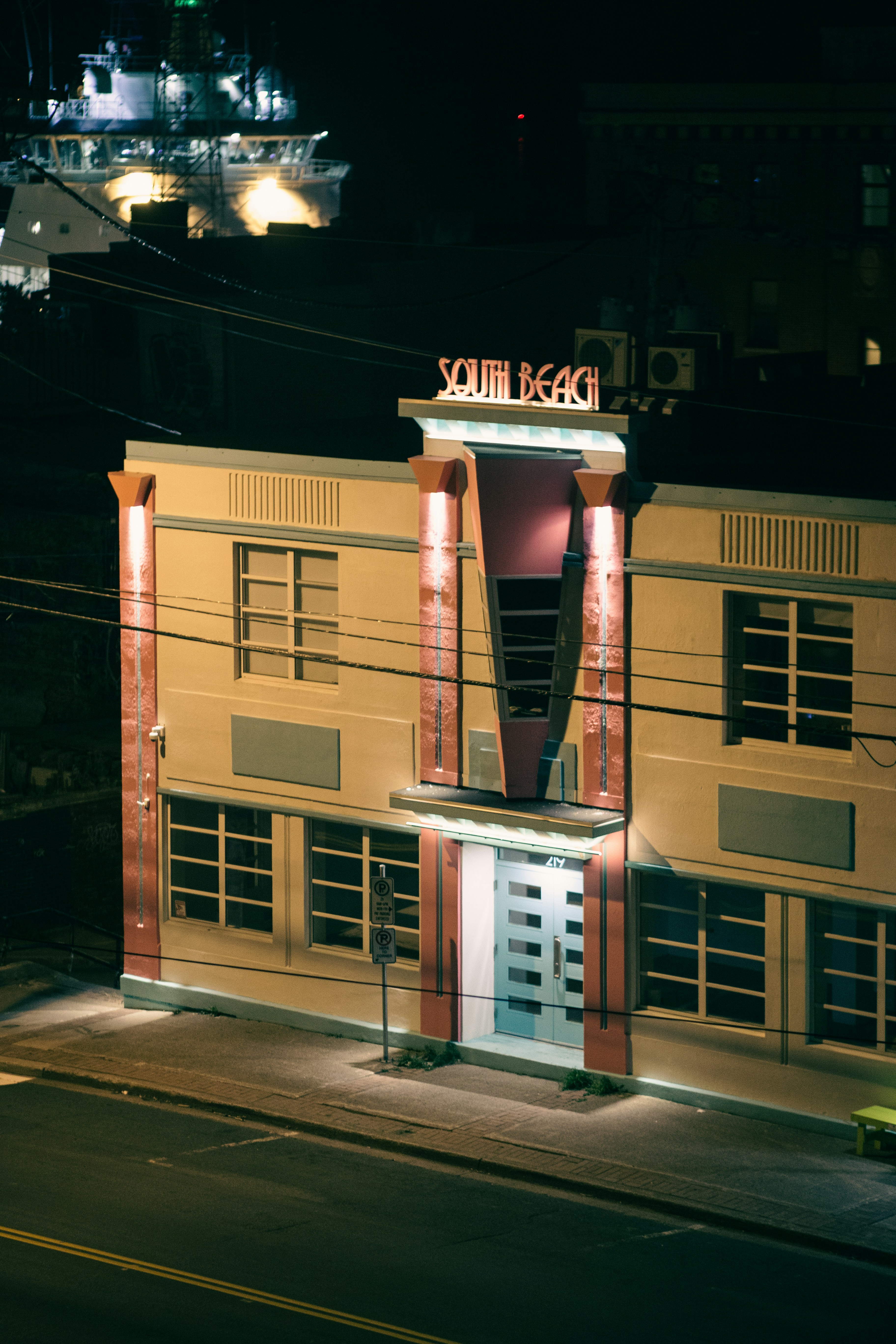 Nighttime Neon Gate: The South Beach Facade Illuminated