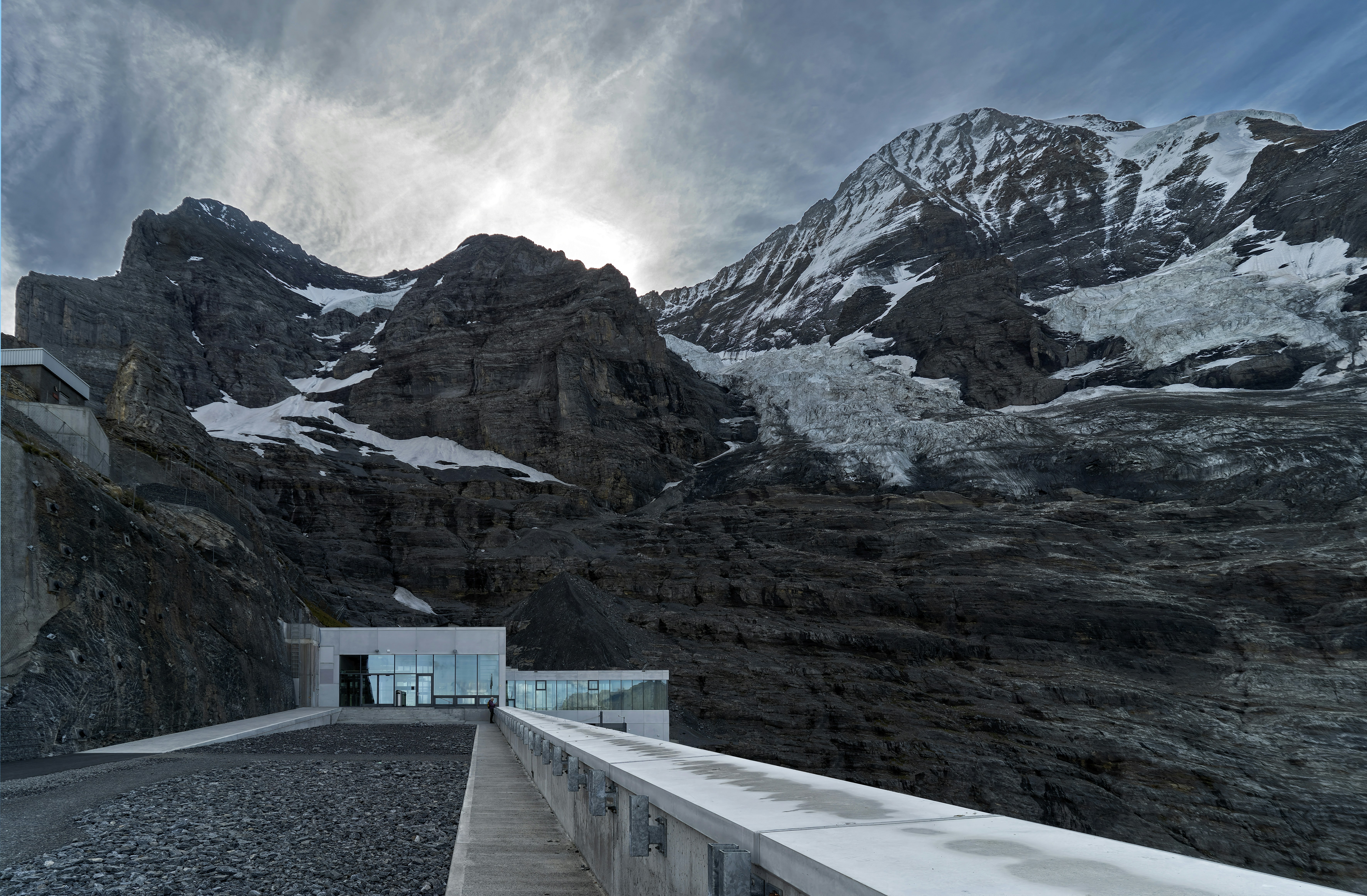 Glass Outpost at the Edge of a Snowbound Ridge