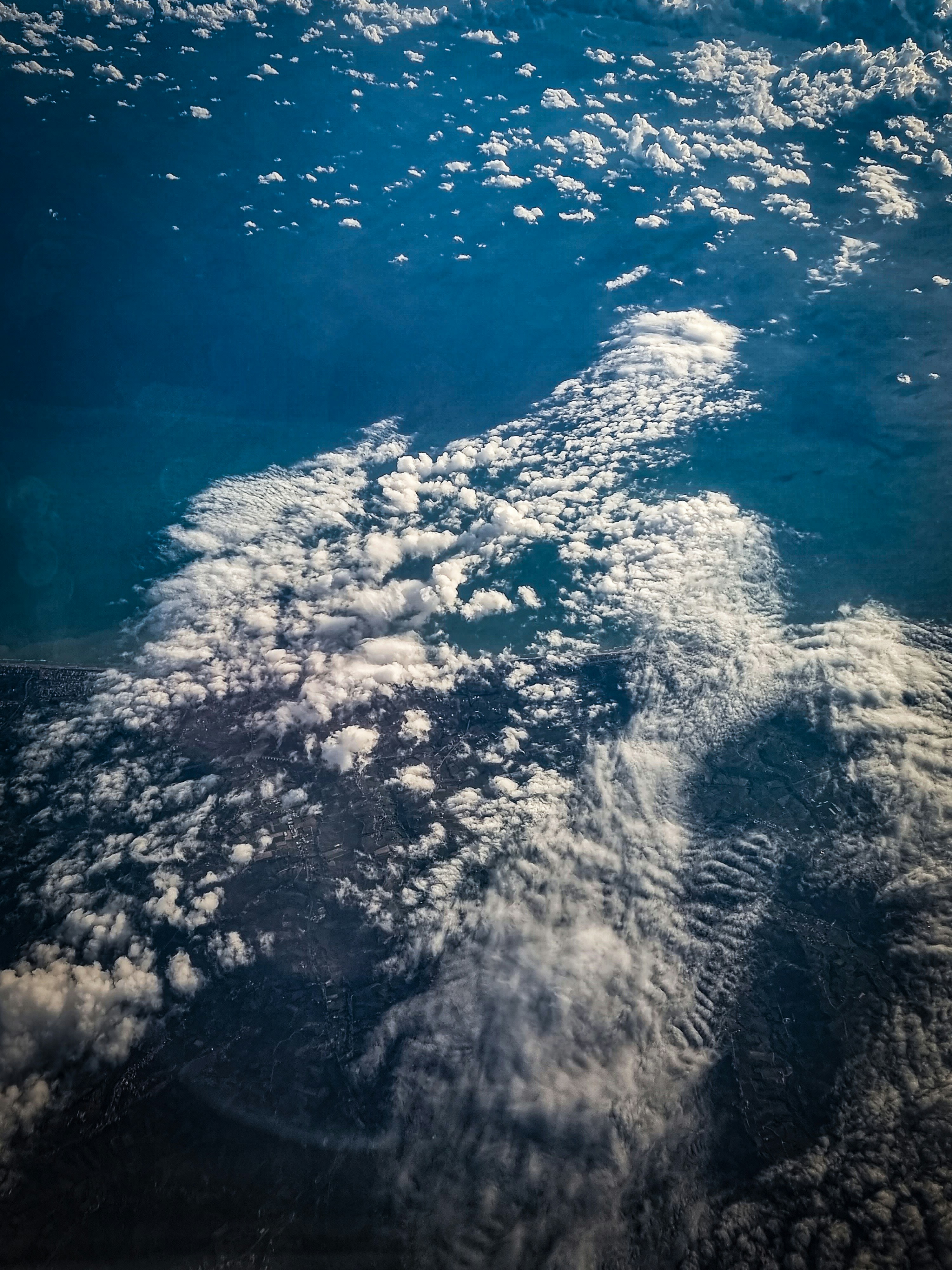 a view of the ocean from an airplane