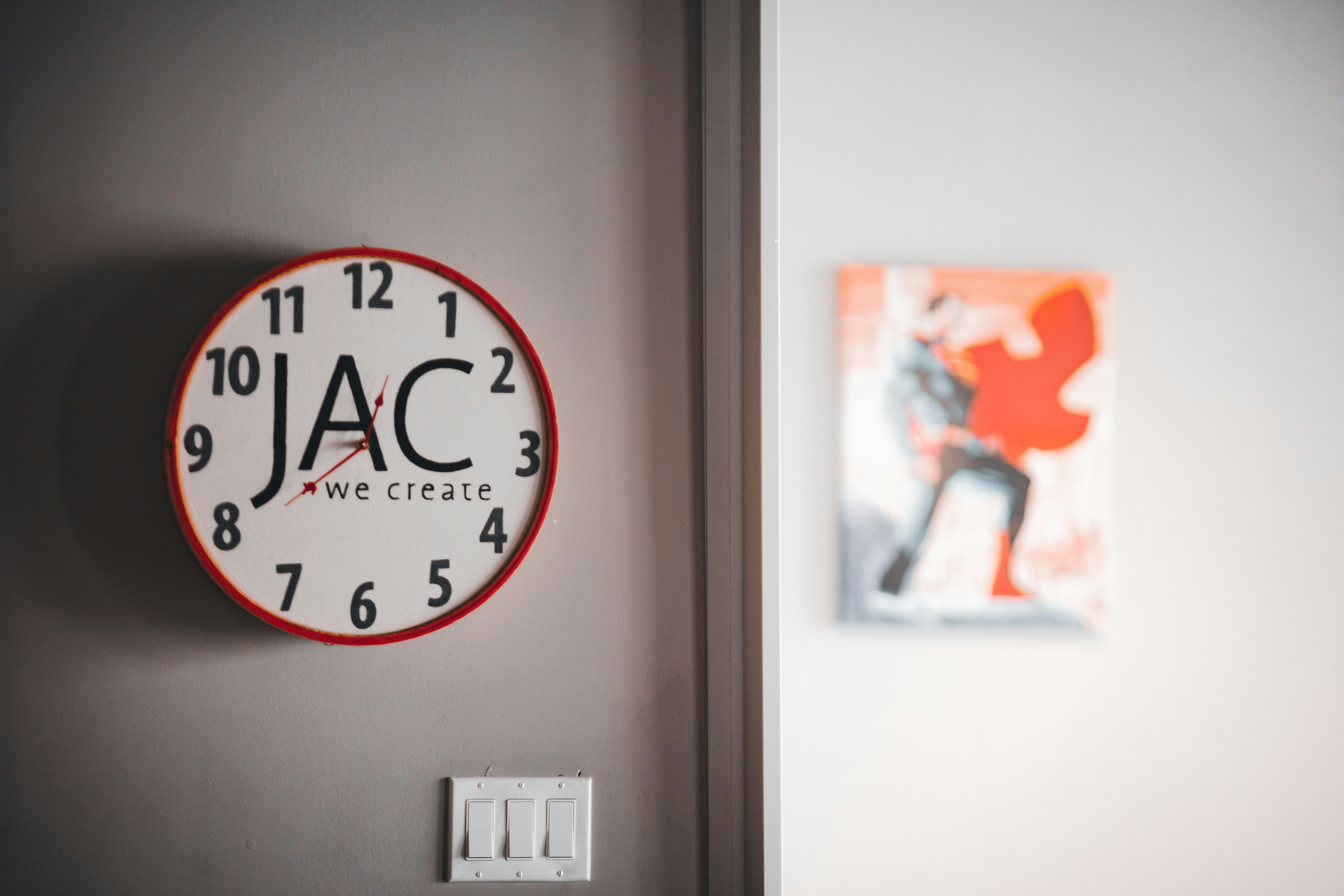 A clock mounted to the side of a wall photo – Free Analog clock Image ...
