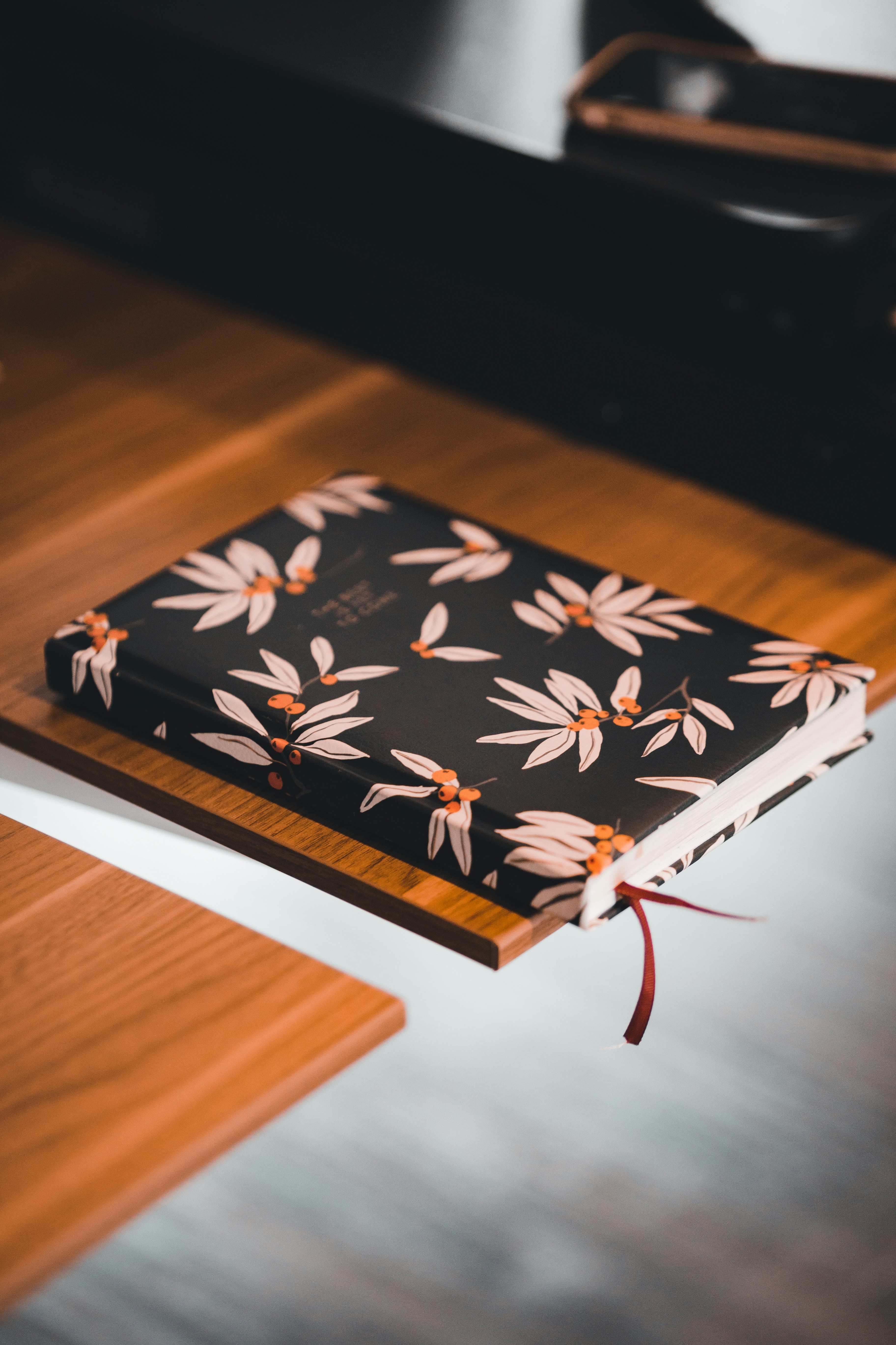 A black notebook with a flower pattern on it photo – Free Text Image on ...