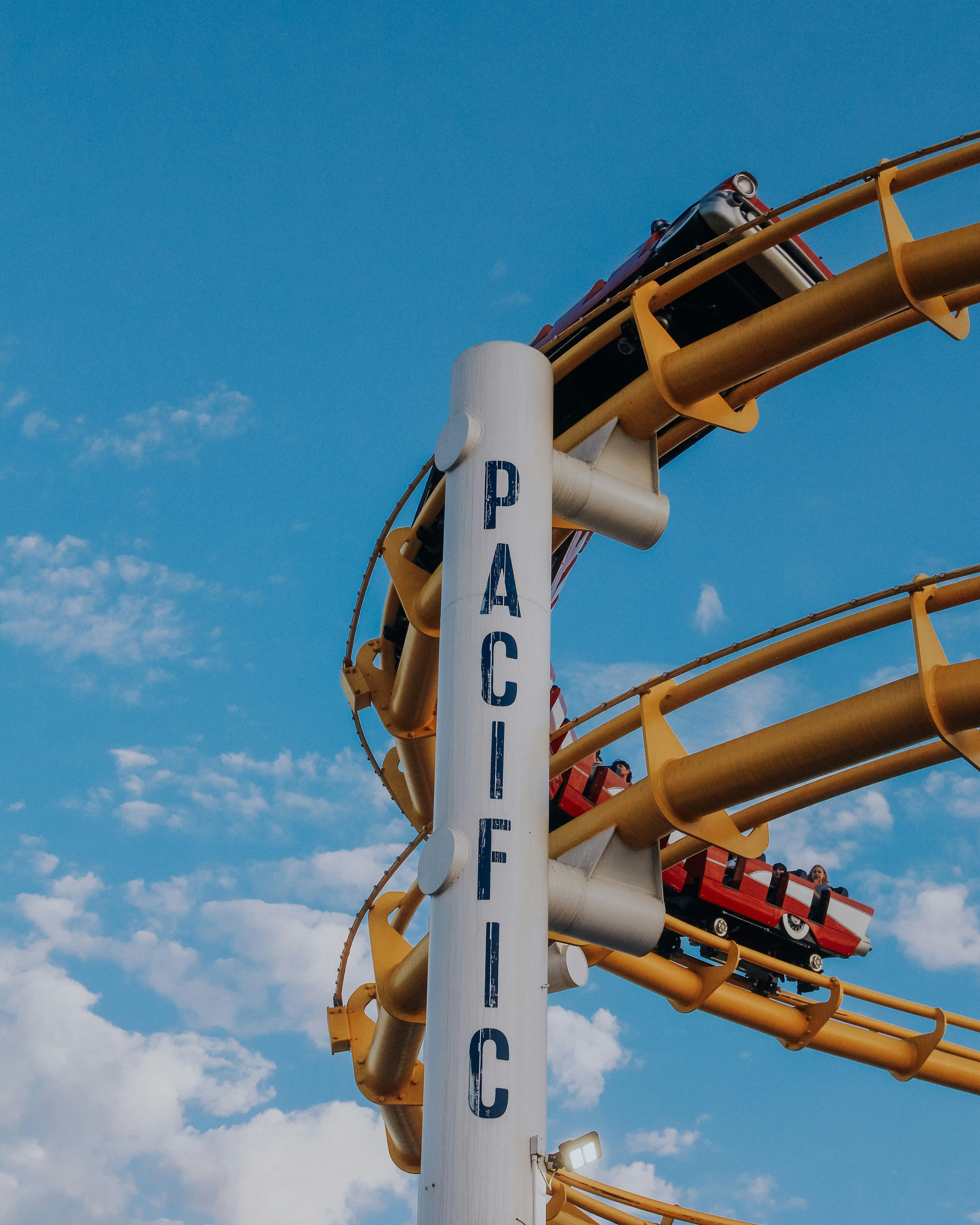A roller coaster with a sign that says pacific photo – Free Blue Image ...