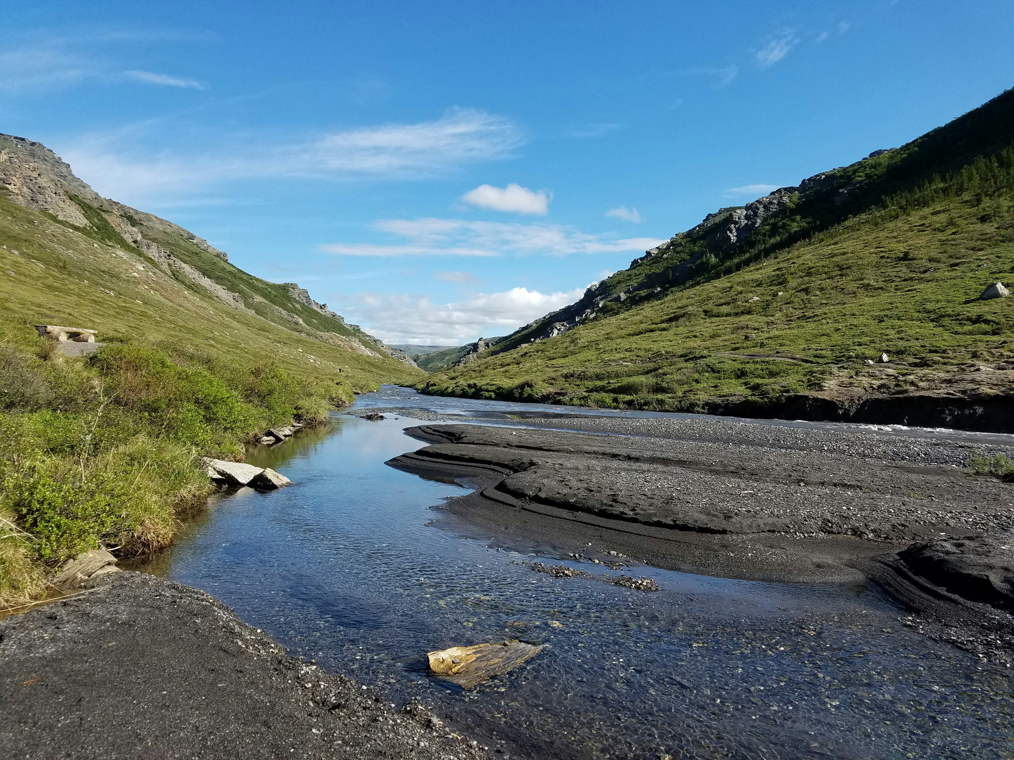 Serpentine Stream Through Verdant Valleys