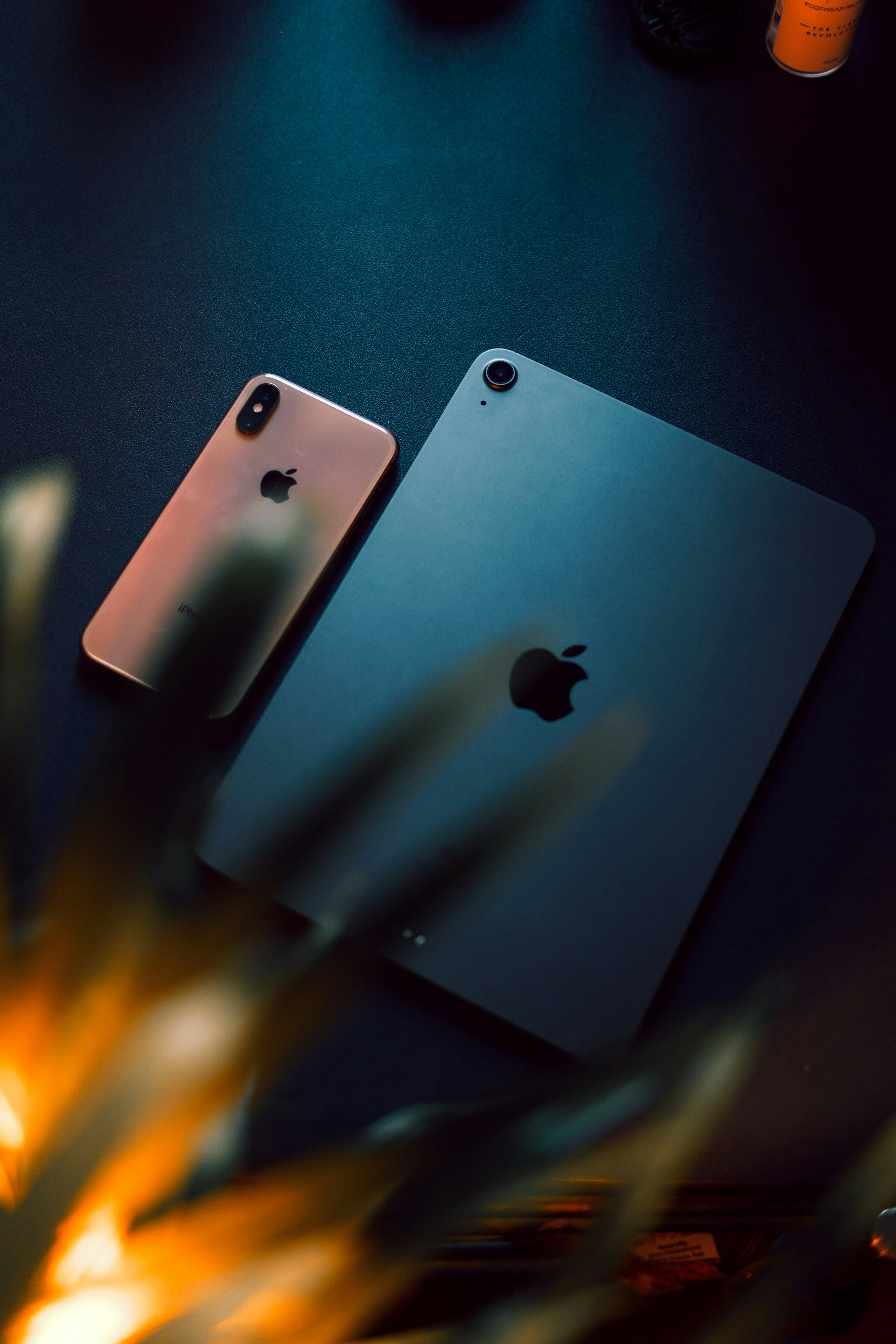 Two iphones sitting next to each other on a table photo – Free India ...