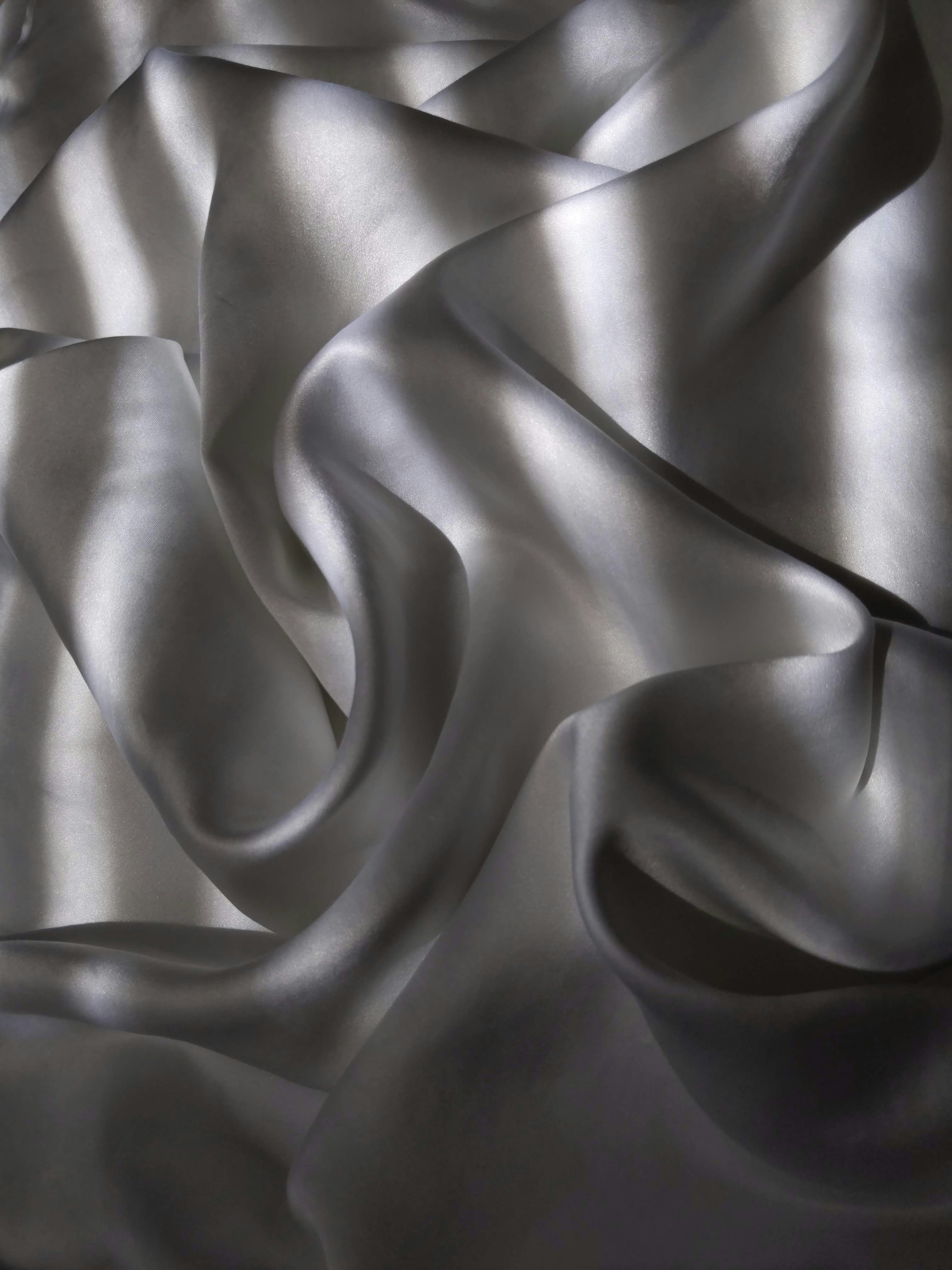 A close up view of a silver fabric photo – Free Silk Image on Unsplash