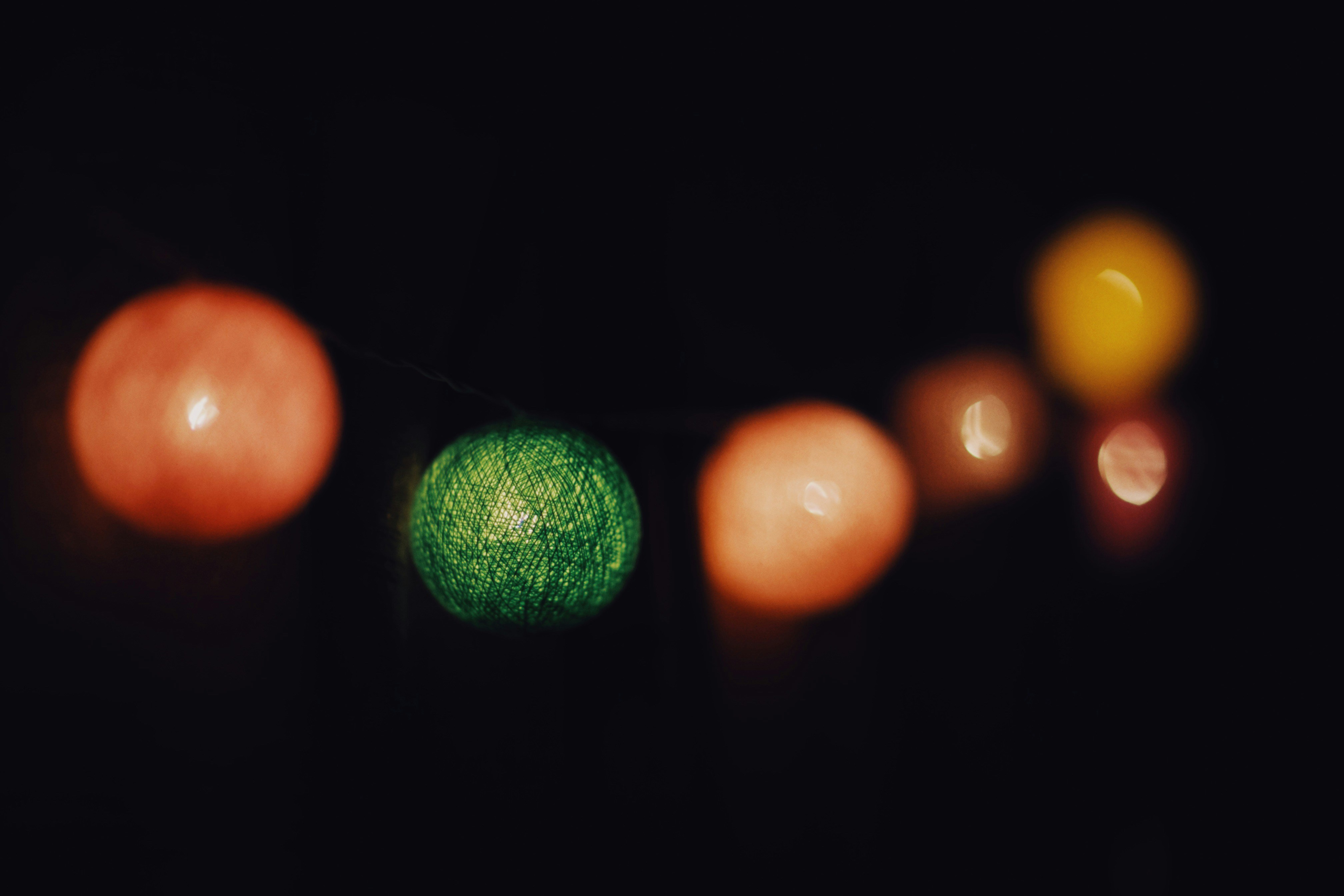 Emerald Orb on Velvet Night: A Quiet String of Bokeh