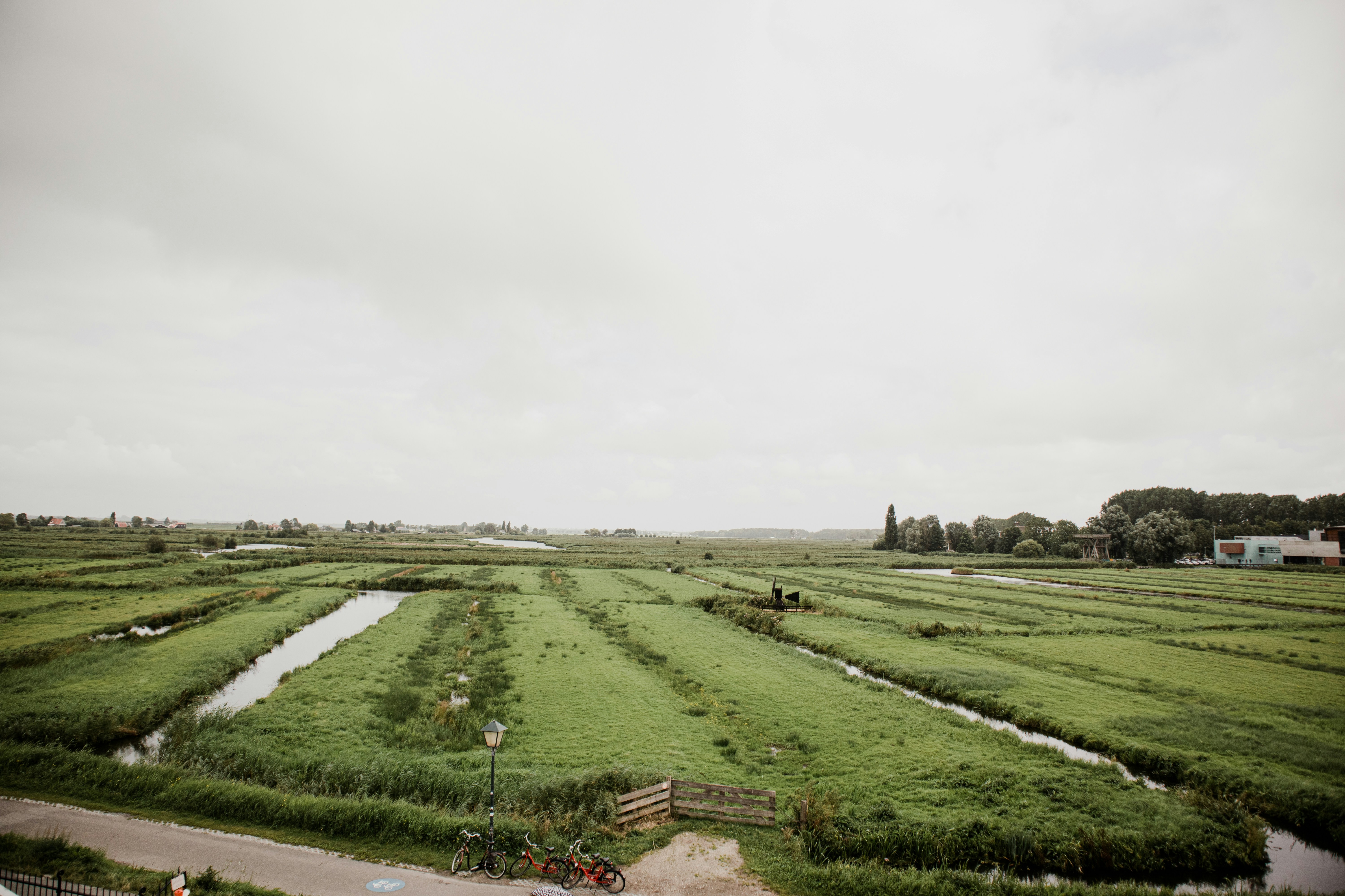 A wide open field with a river running through it photo – Free Land ...