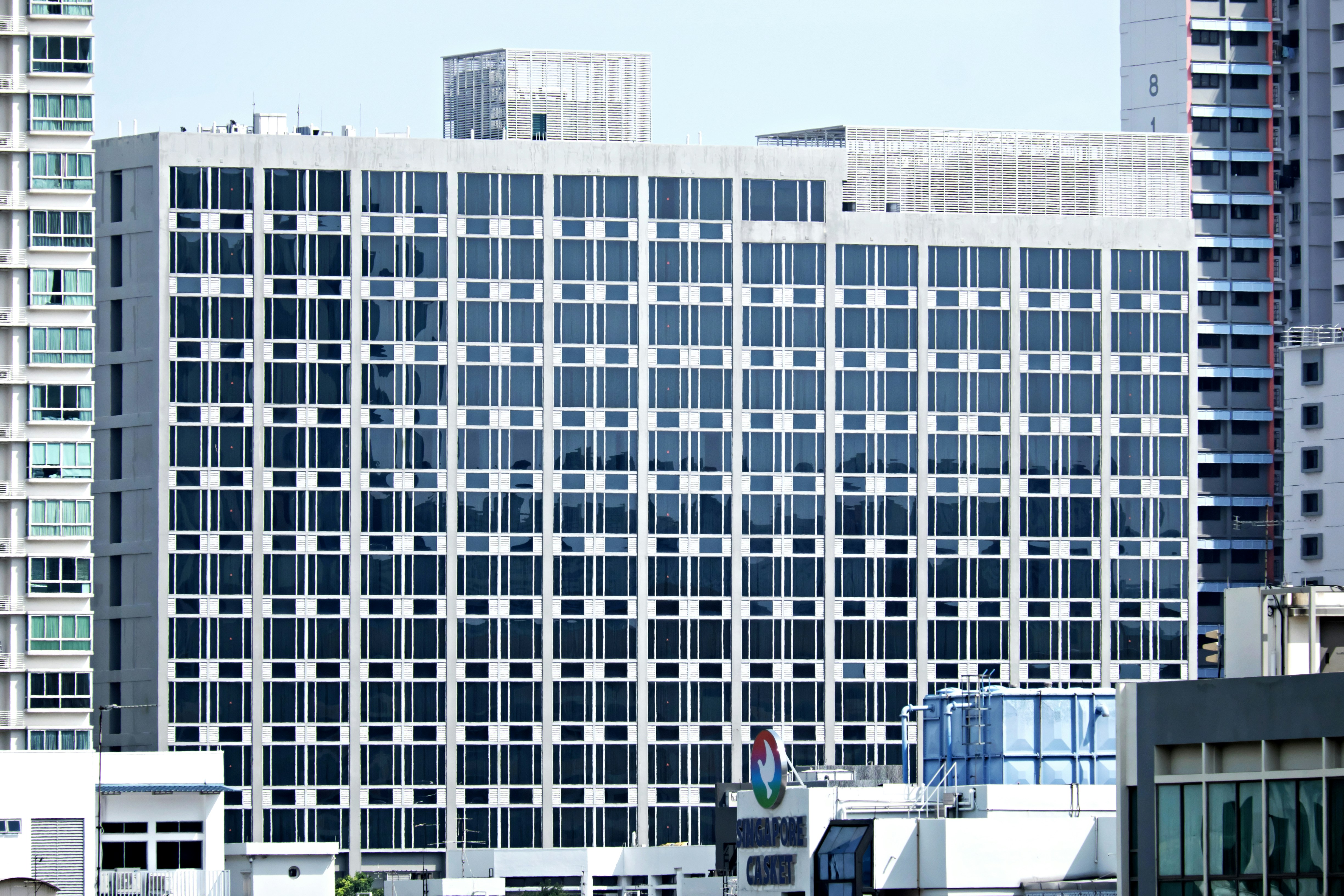 A large building with a lot of windows on it photo – Free Grey Image on ...