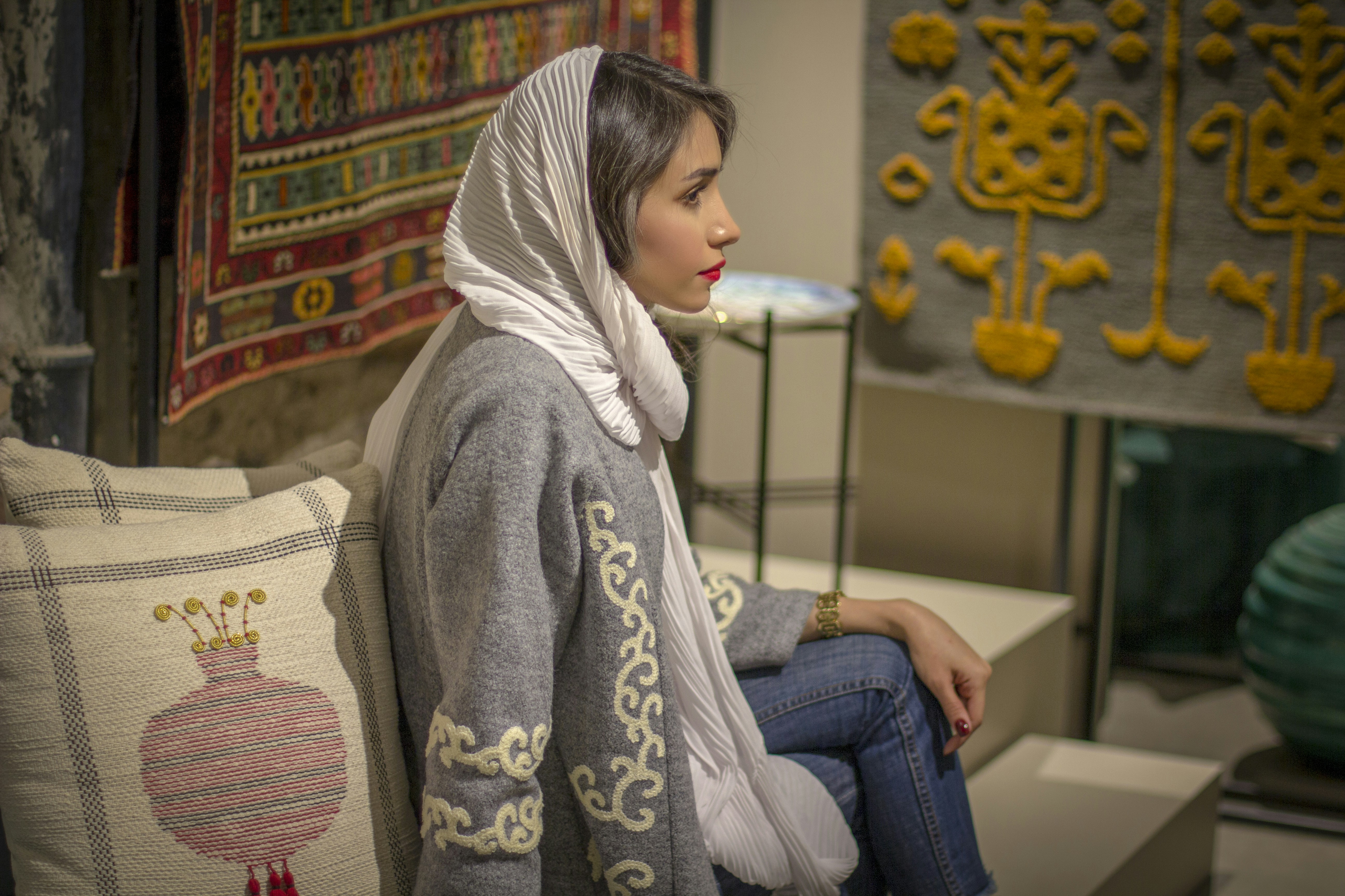 Profile in Silk and Warm Light: A Moment Among Loomed Textiles