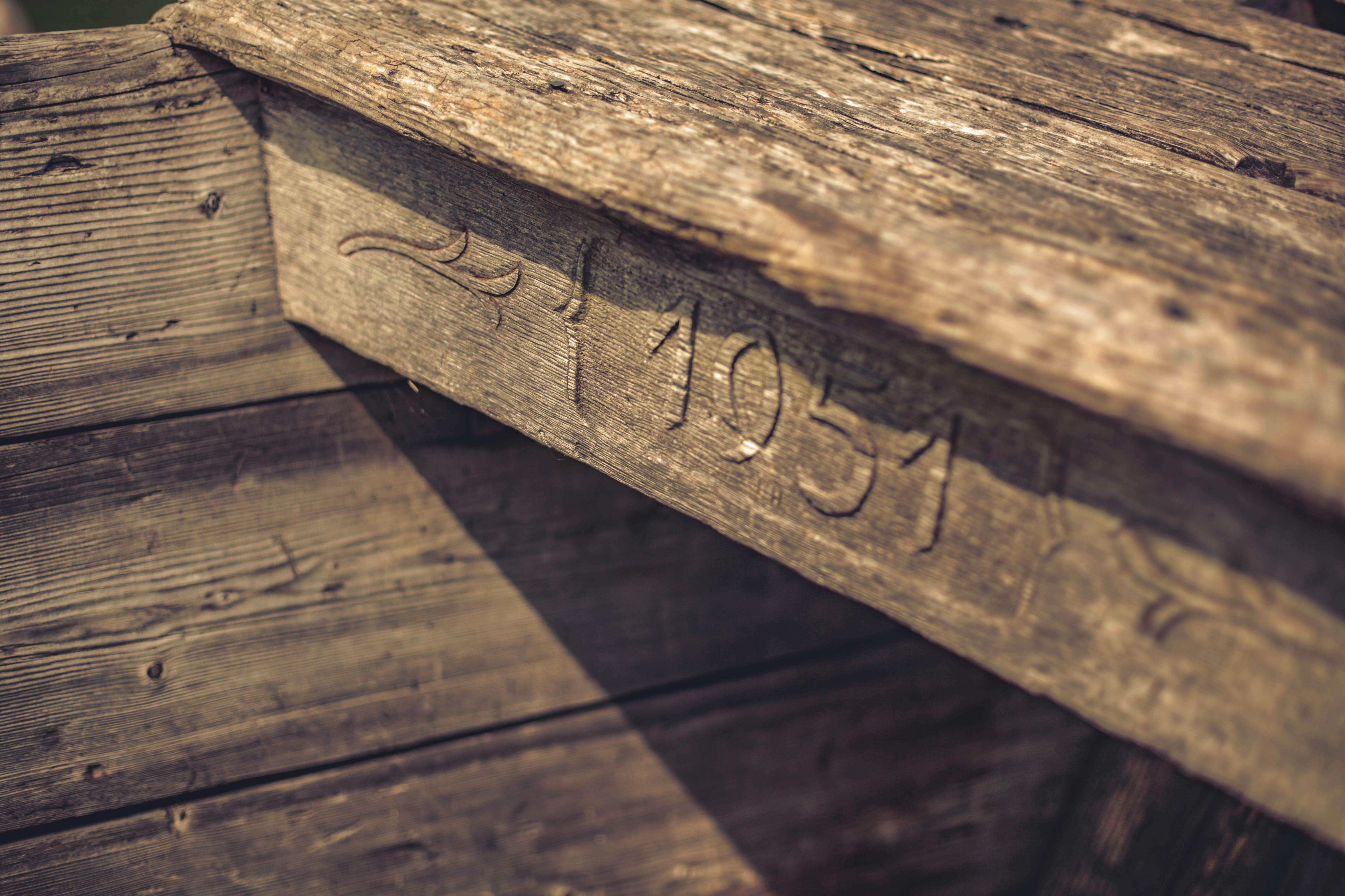 A close up of a wooden bench with numbers on it photo – Free Furniture ...