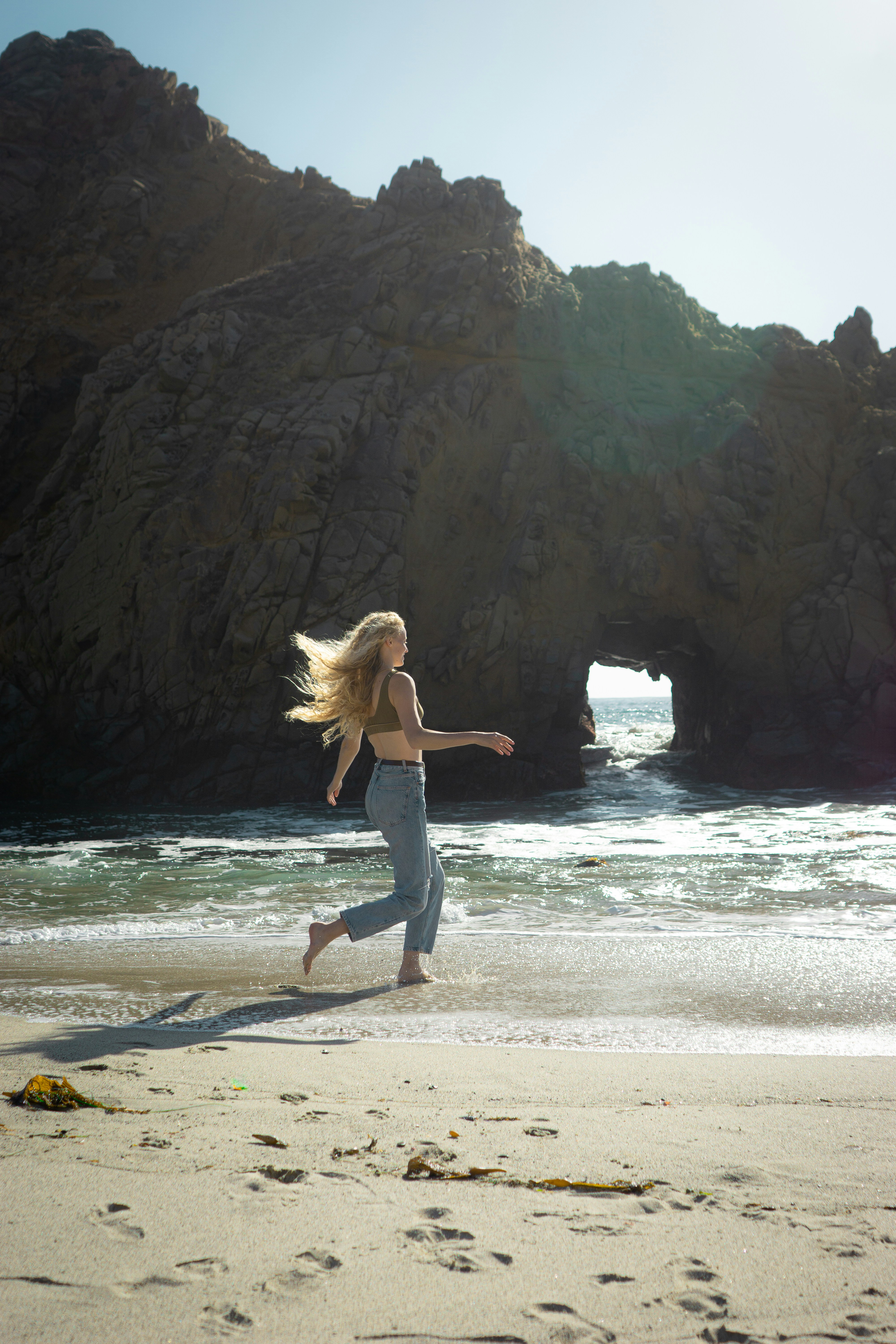 Stride of Light by the Sea Arch