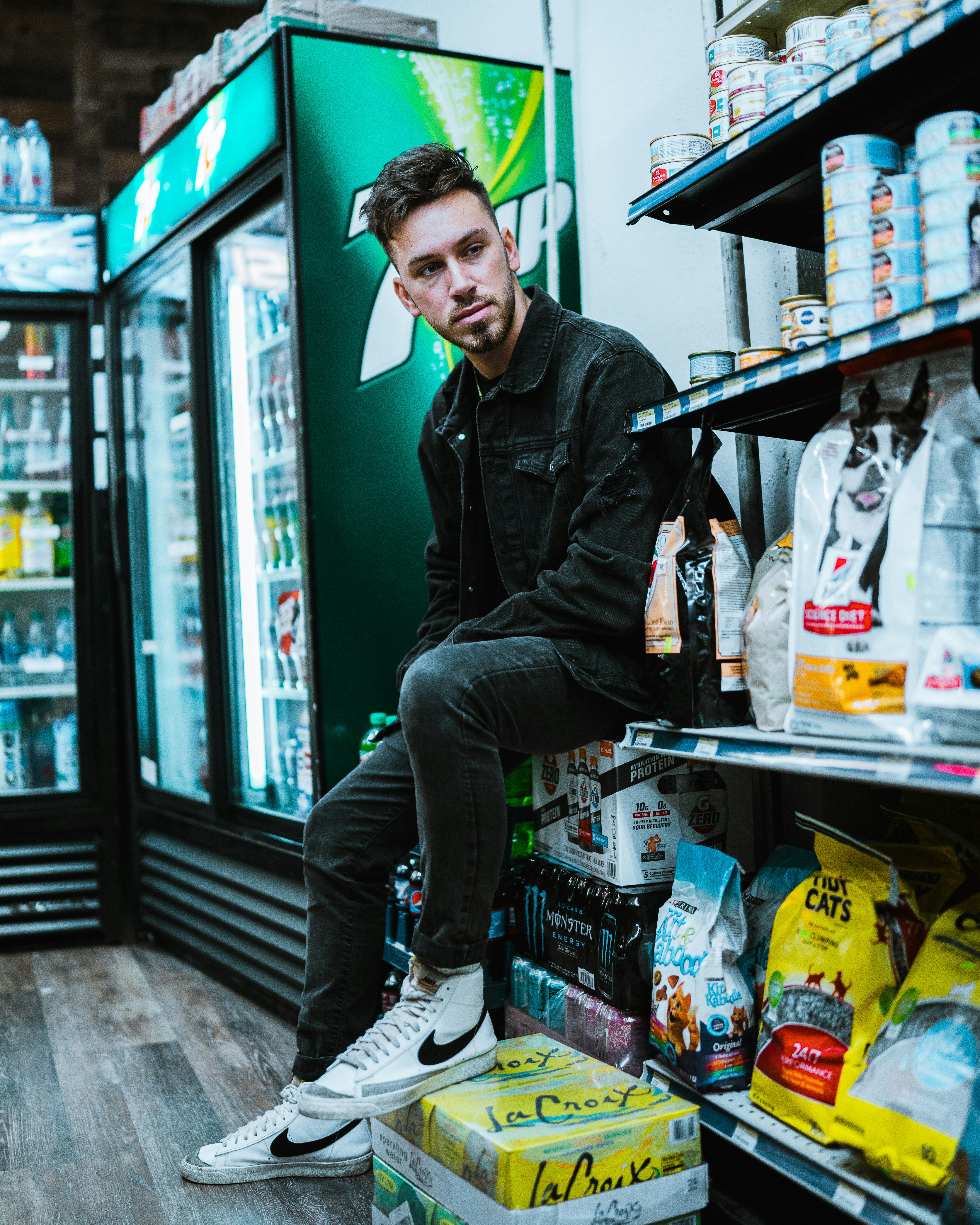 Neon Aisle Portrait: A Quiet Moment by the Cooler