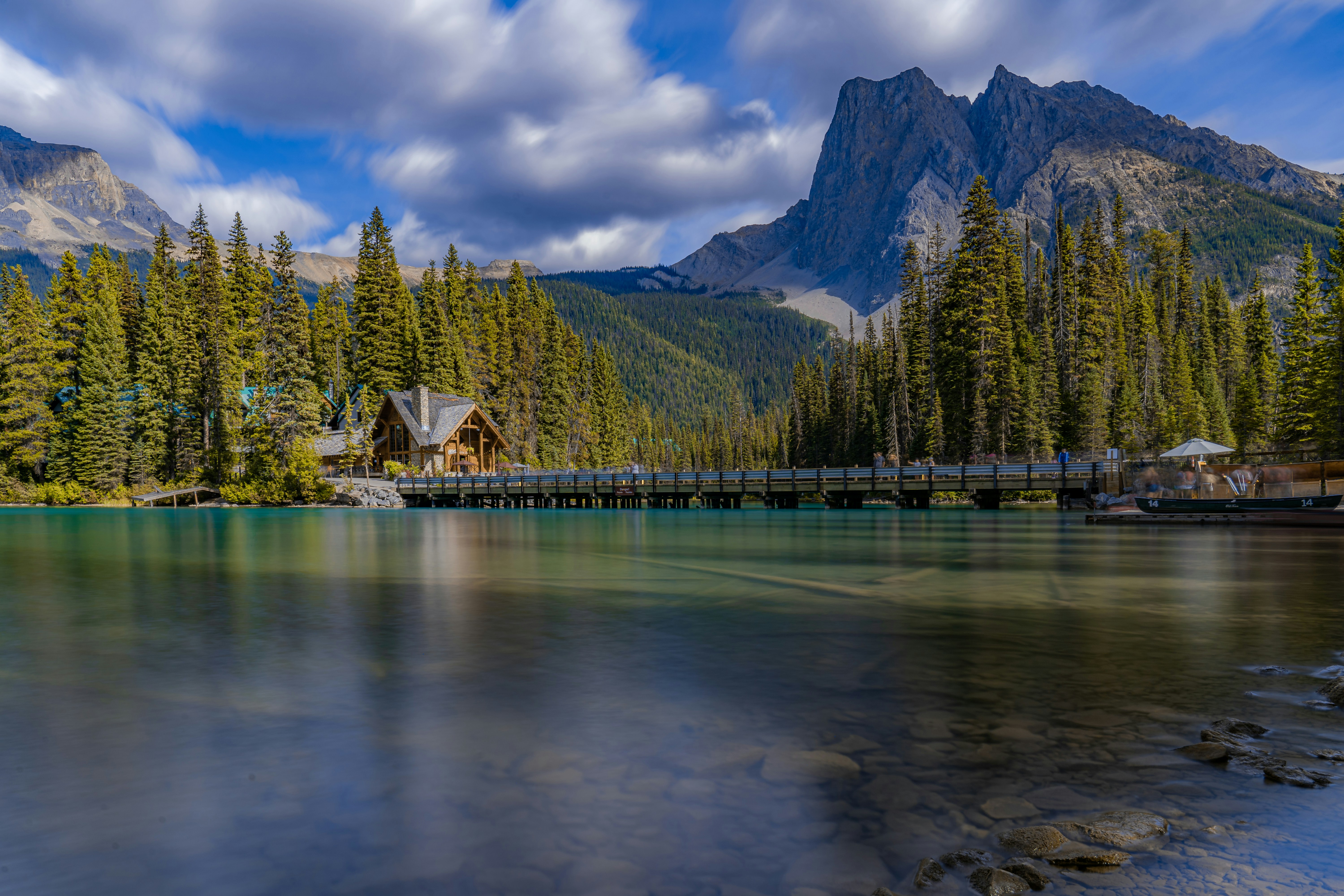 Lodge Pier at Turquoise Lake Under Jagged Peaks