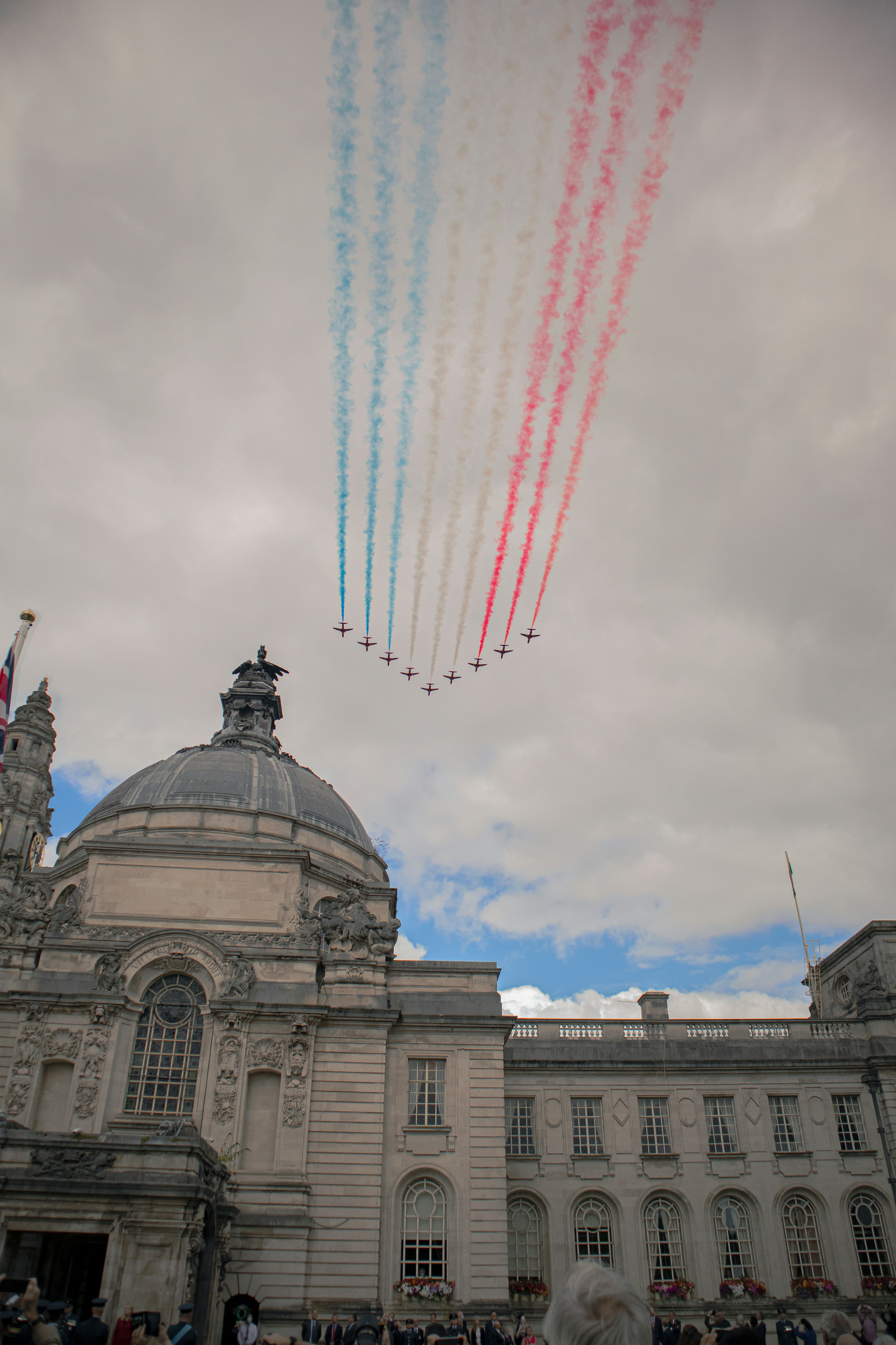 a group of airplanes flying over a building
