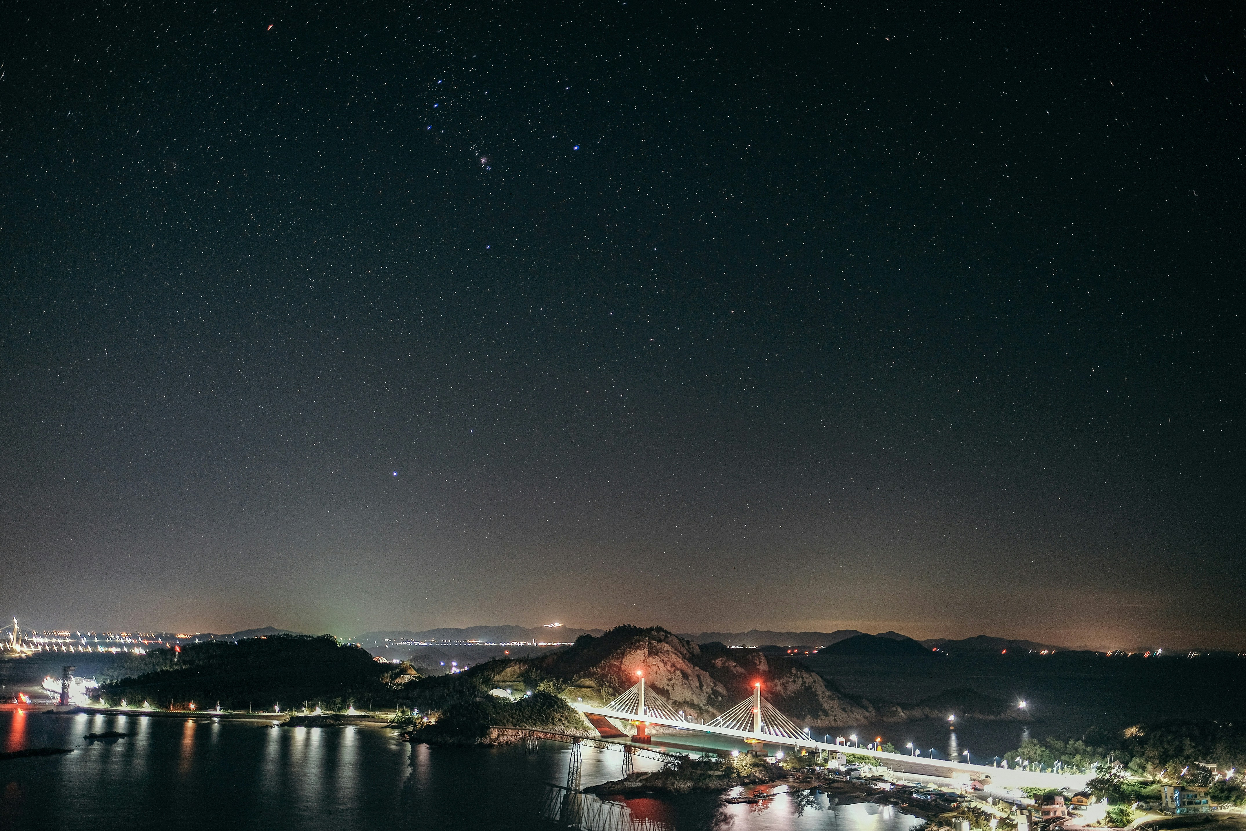 Starlit Bridge, Quiet Harbor: Night Currents Under a City of Lights