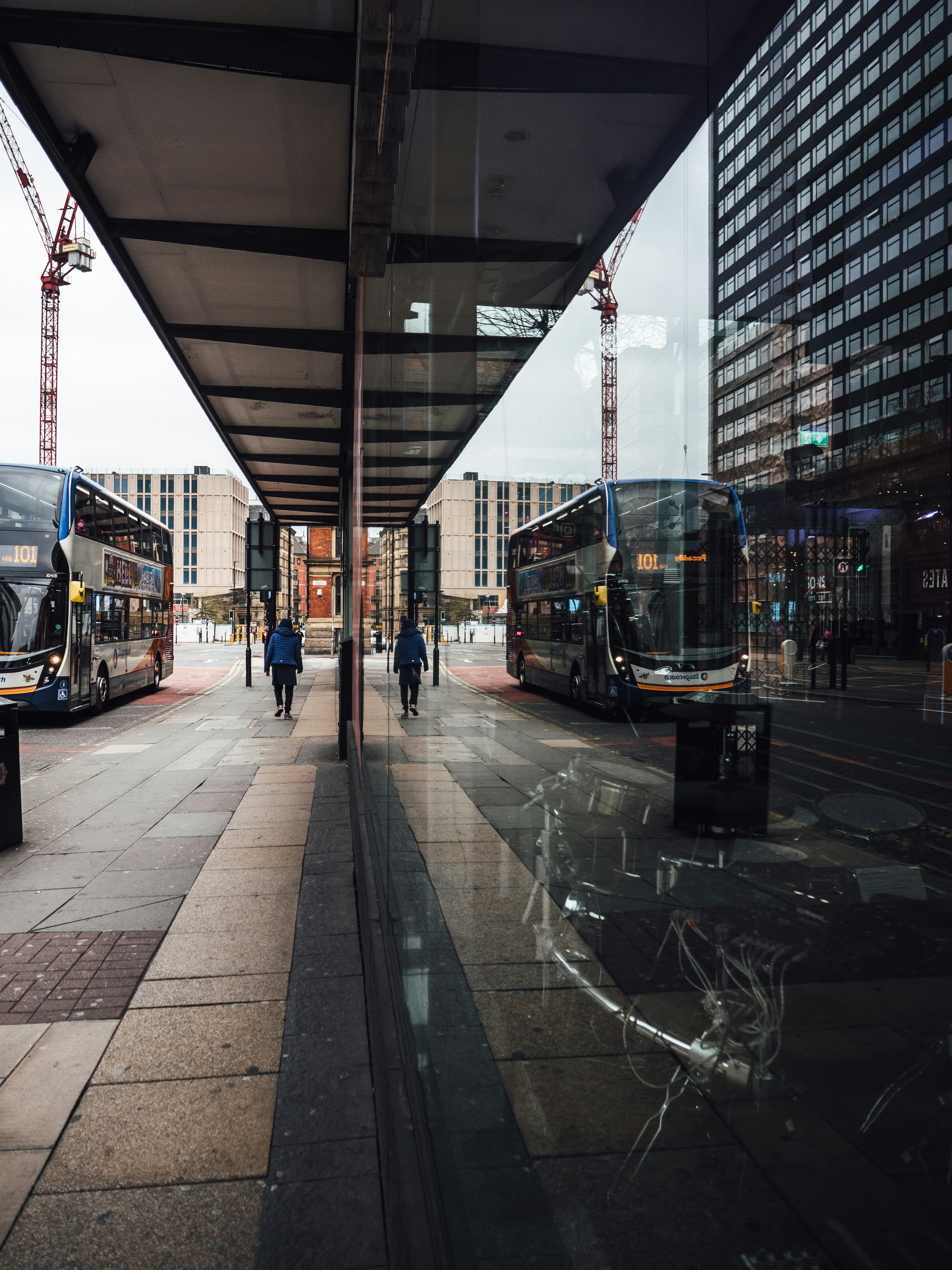 Mirrored Corridor: Urban Transit Framed by Glass and Steel