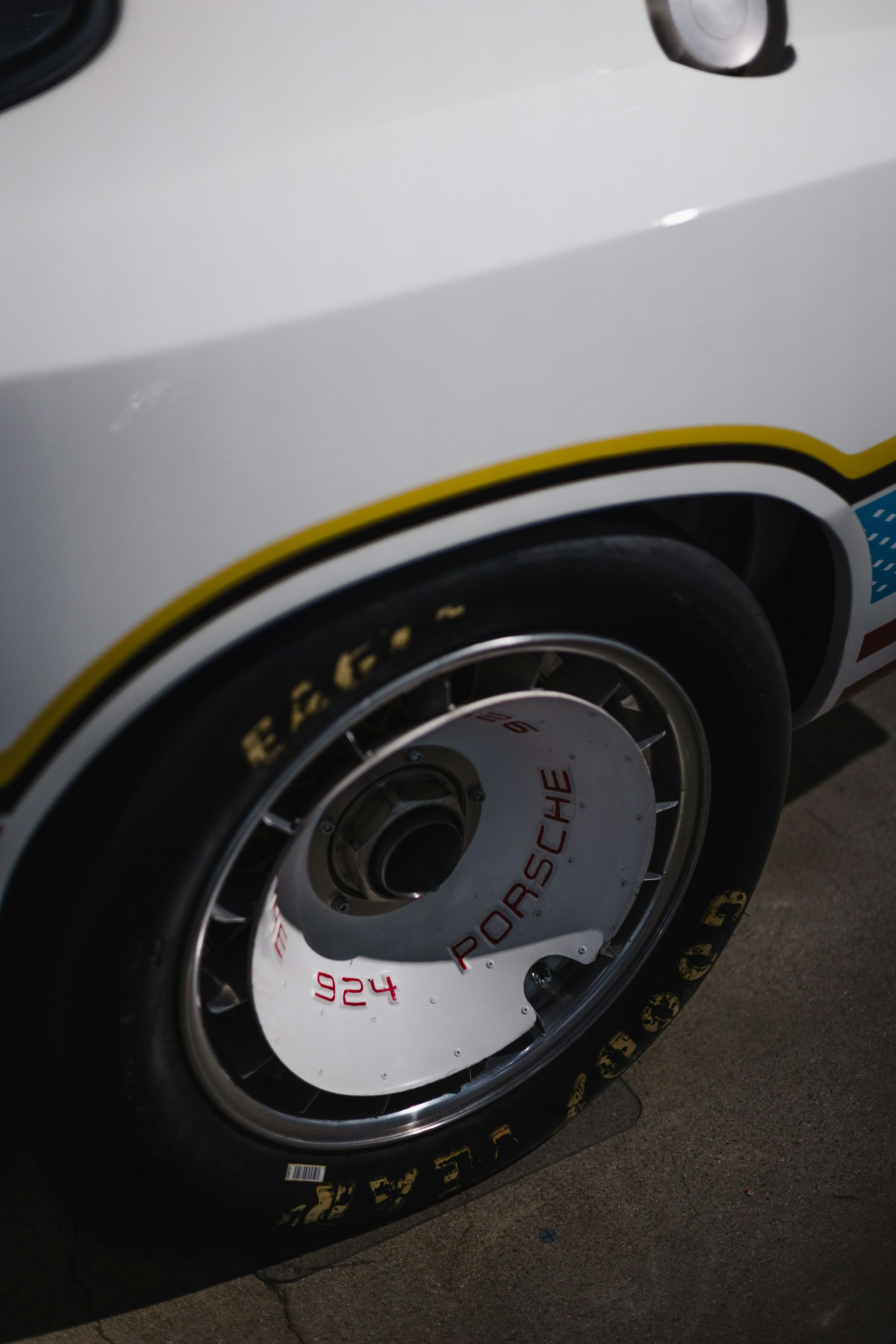 White Porsche 924 wheel close-up: racing hub and tire details