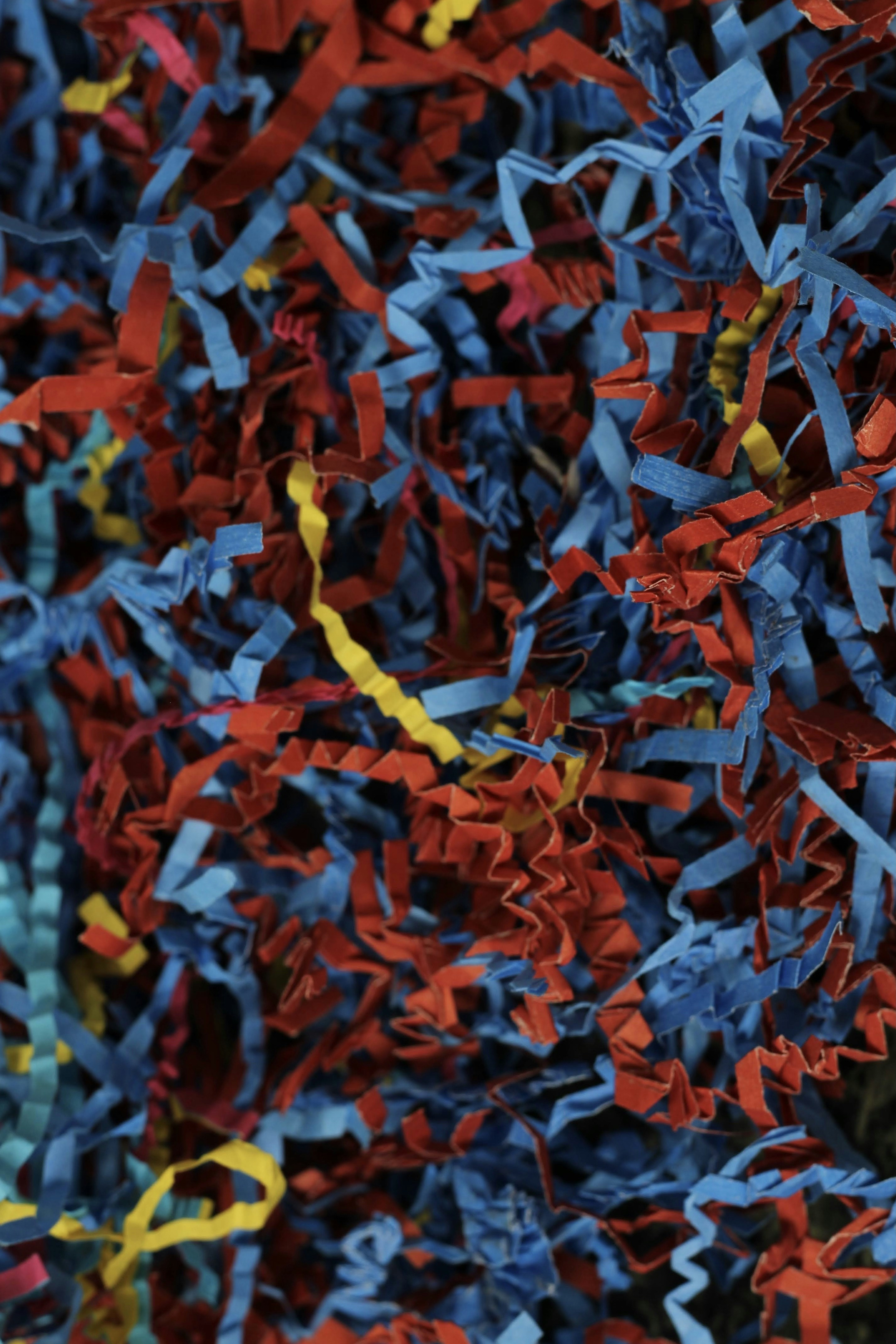 A bunch of red, blue, and yellow streamers photo – Free Art Image on ...