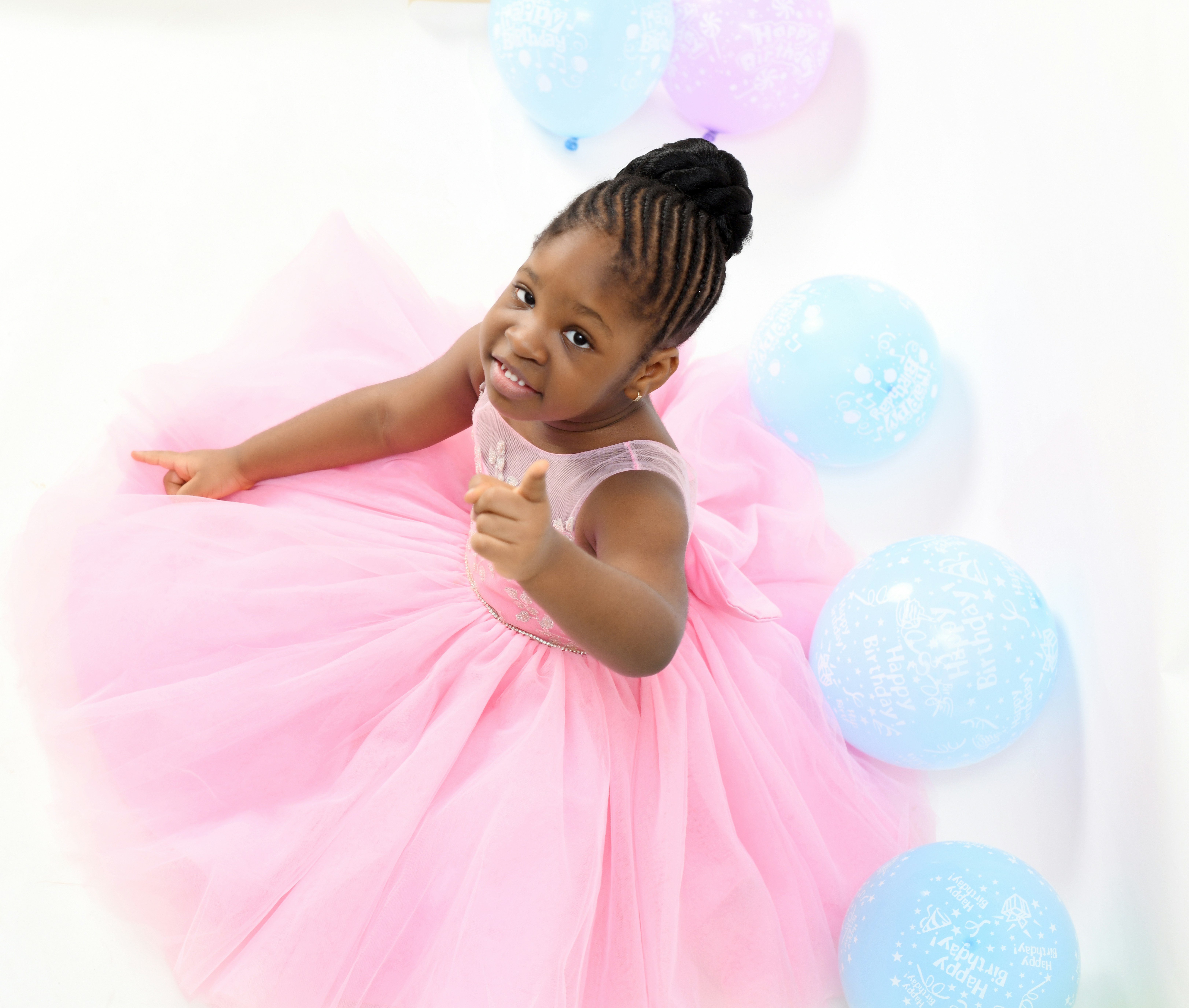 A little girl in a pink dress posing for a picture photo – Free Girl ...