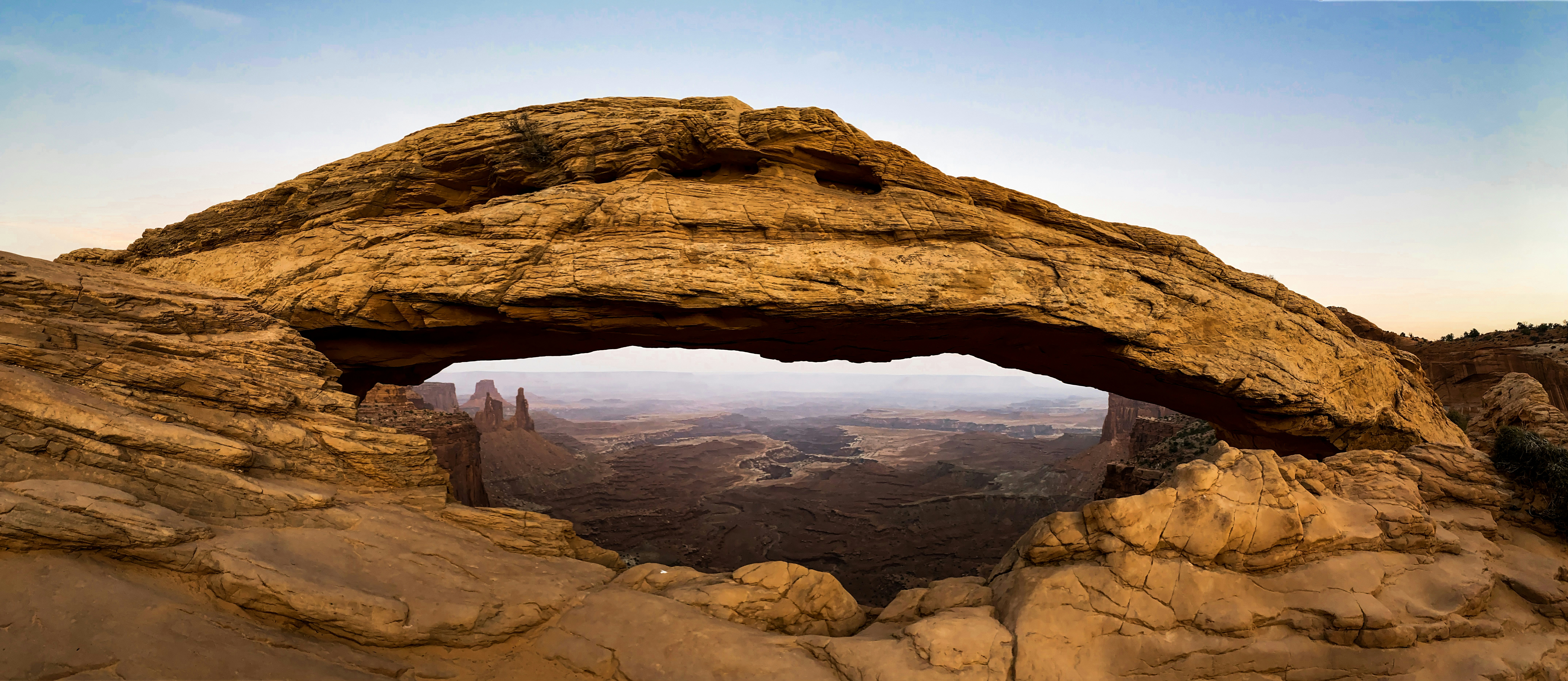 A rock formation with a hole in the middle of it photo – Free Usa Image ...