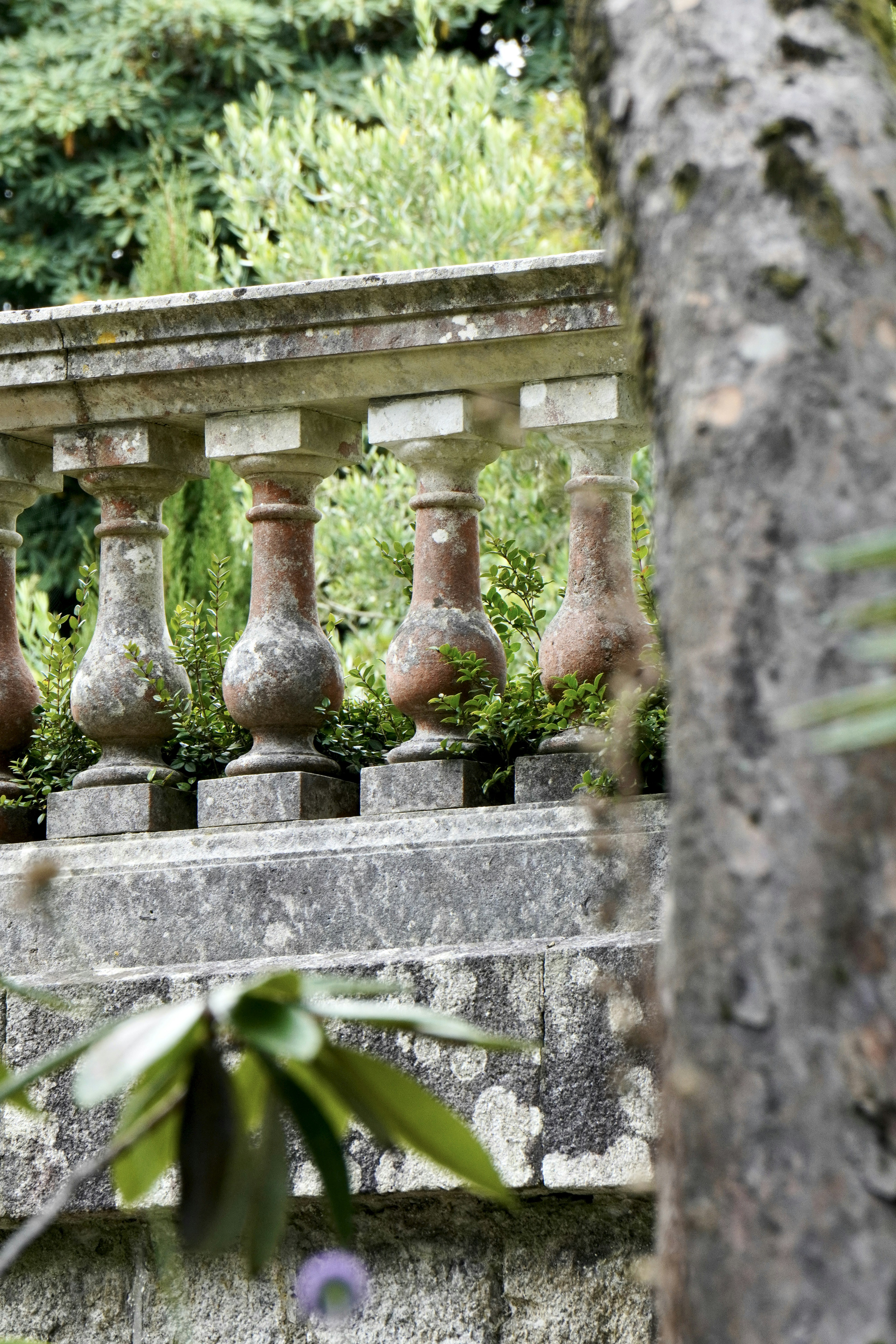 a group of vases sitting on top of a stone wall